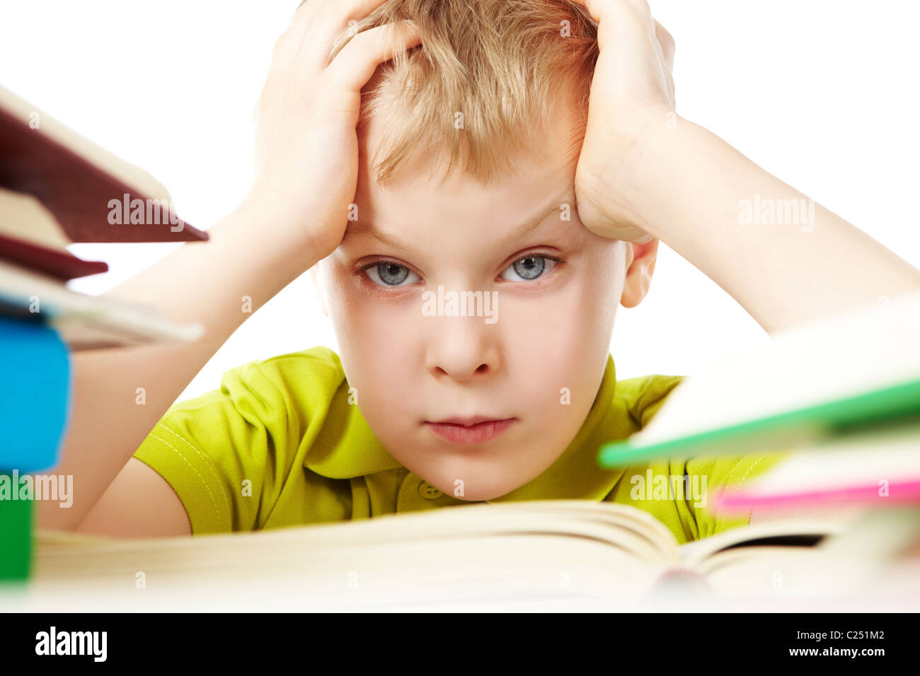 Portrait of a little boy among books Stock Photo - Alamy