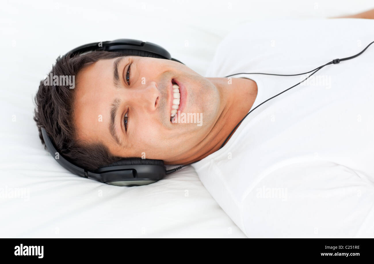 Man lying on the bed Cut Out Stock Images & Pictures - Alamy