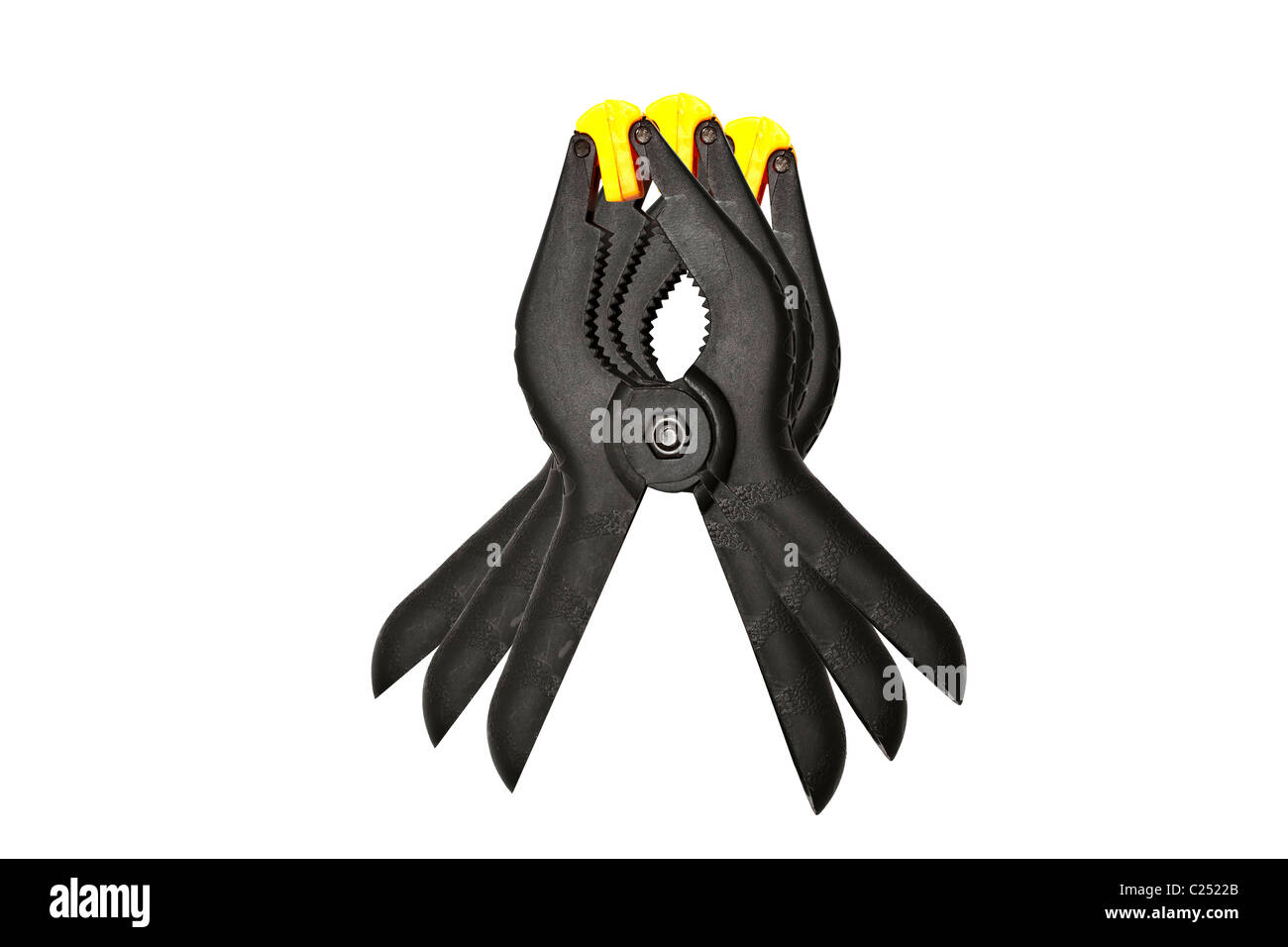 Black spring clamps isolated on white background Stock Photo - Alamy