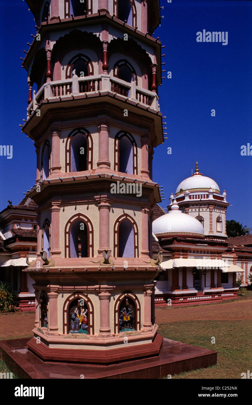 lamp tower and temple ponda goa india Stock Photo - Alamy