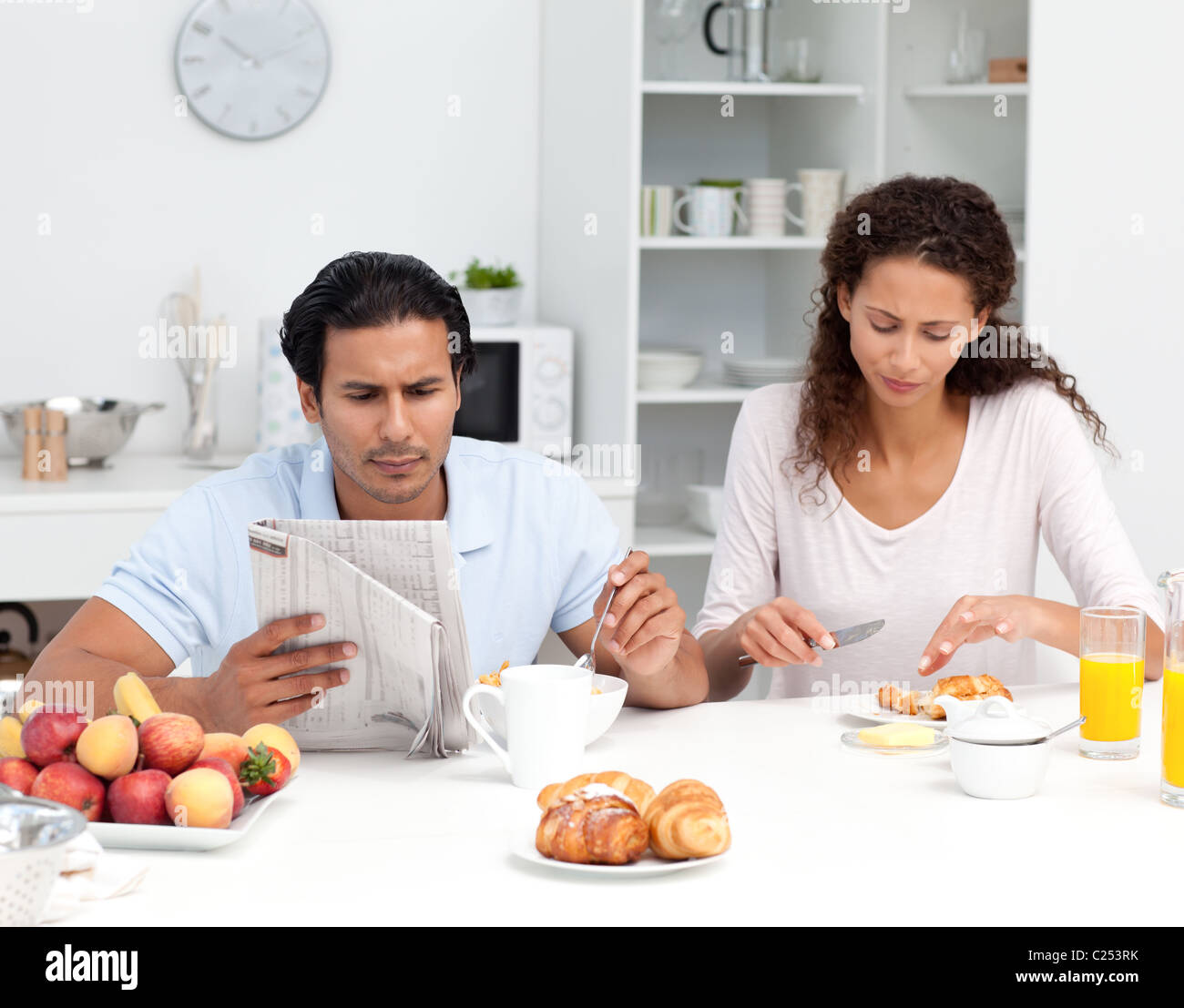 Lovely couple eating cereals and croissants together Stock Photo - Alamy