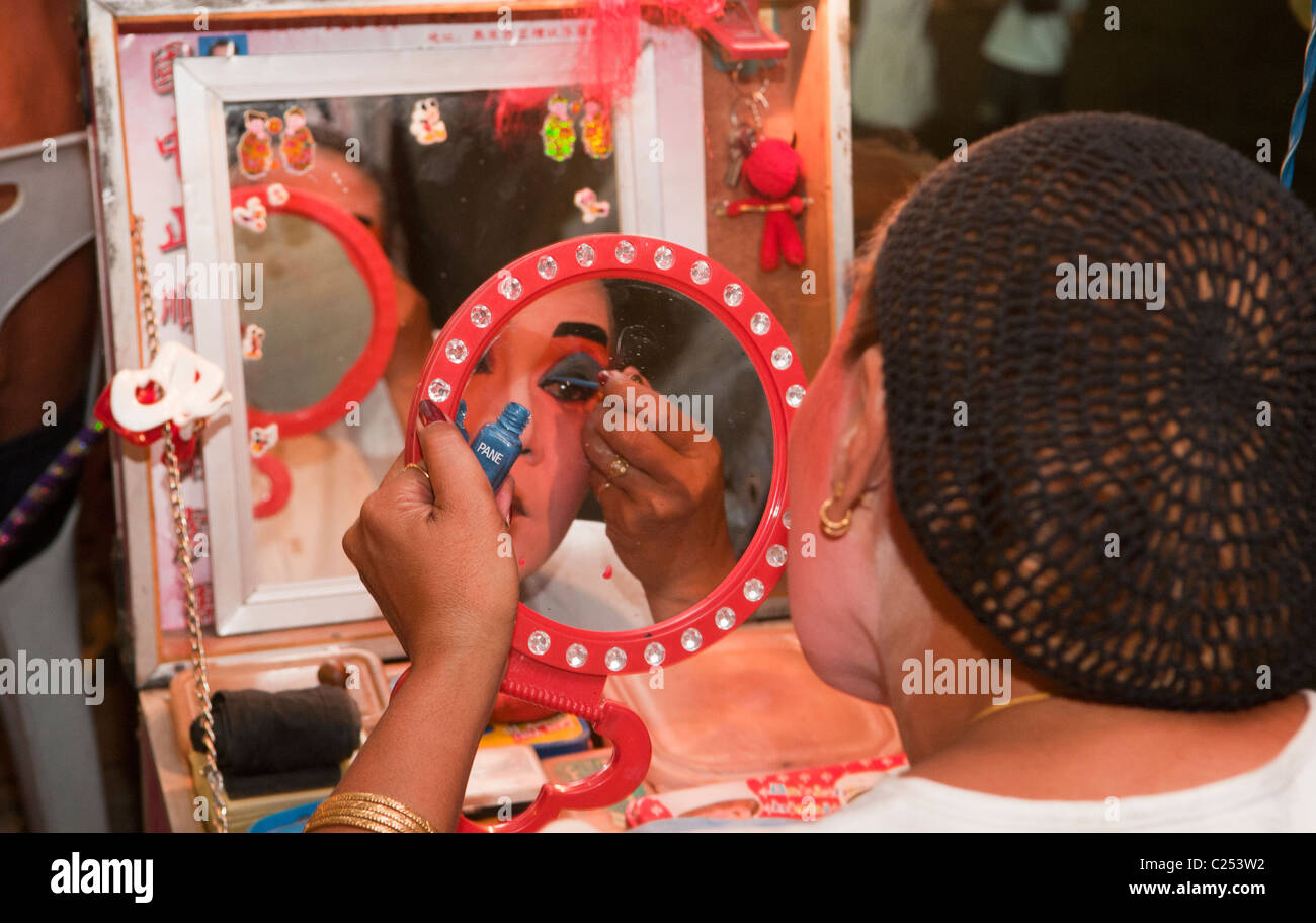 Chinese opera performer applies makeup backstage in Bangkok, Thailand ...