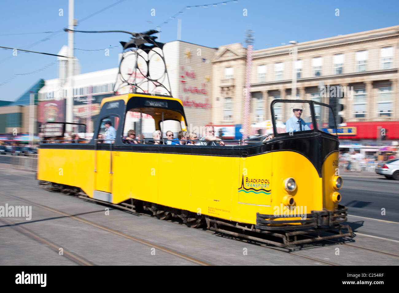 A colourful tram on the promenade at Blackpool Beach in Lancashire ...