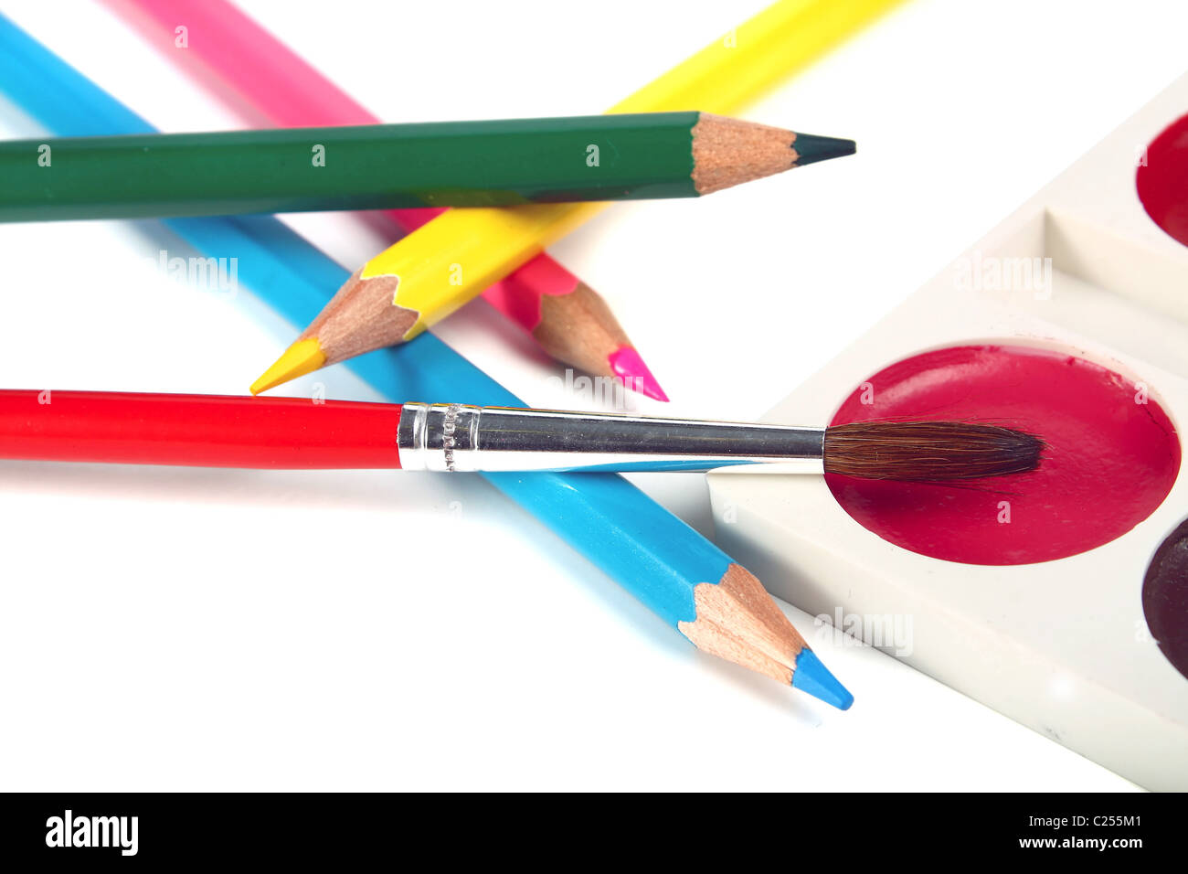 crayons coloured pencils and brush for paints isolated on white ...