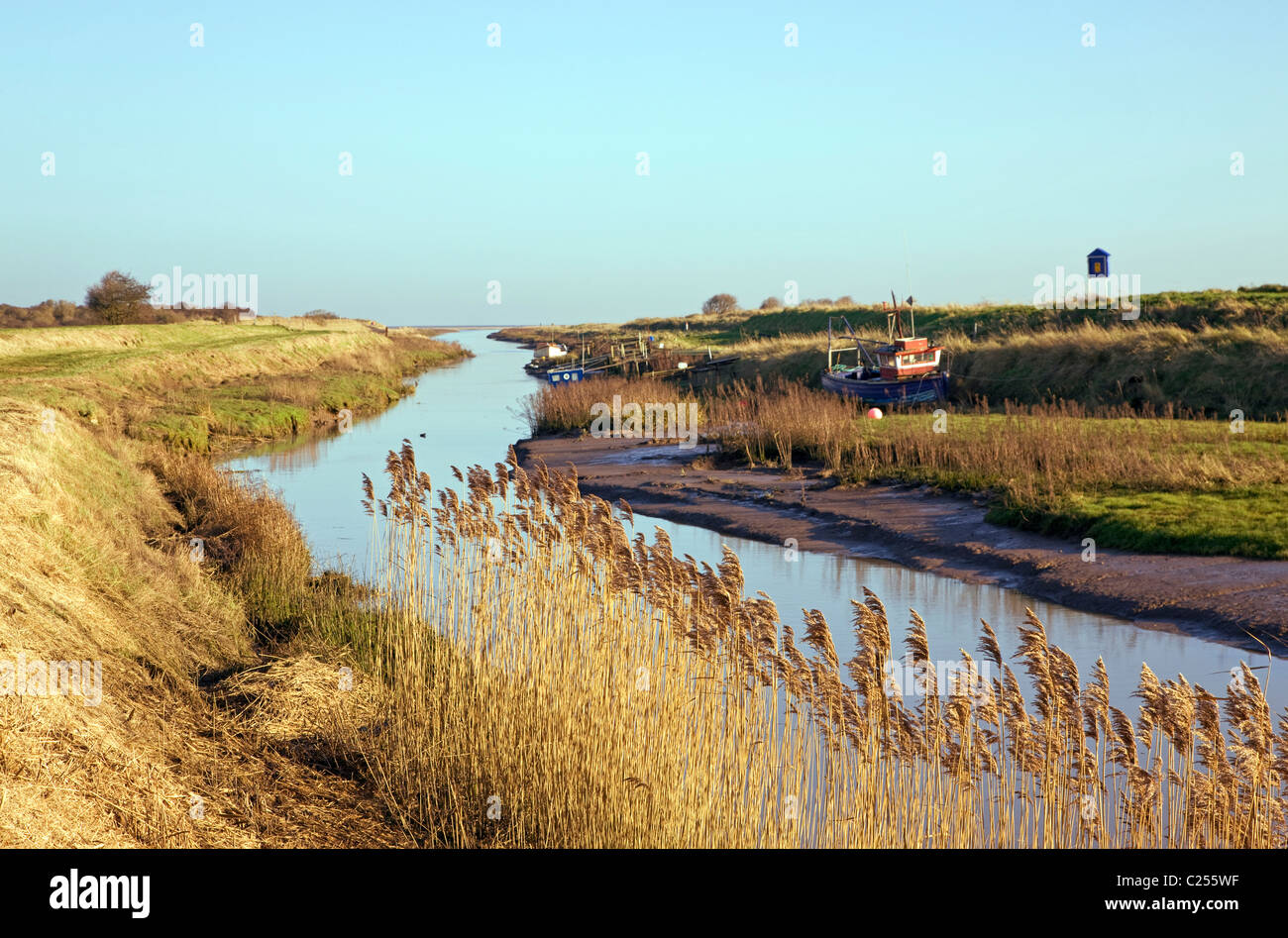 Boats moored along the water at Saltfleet Haven Stock Photo - Alamy