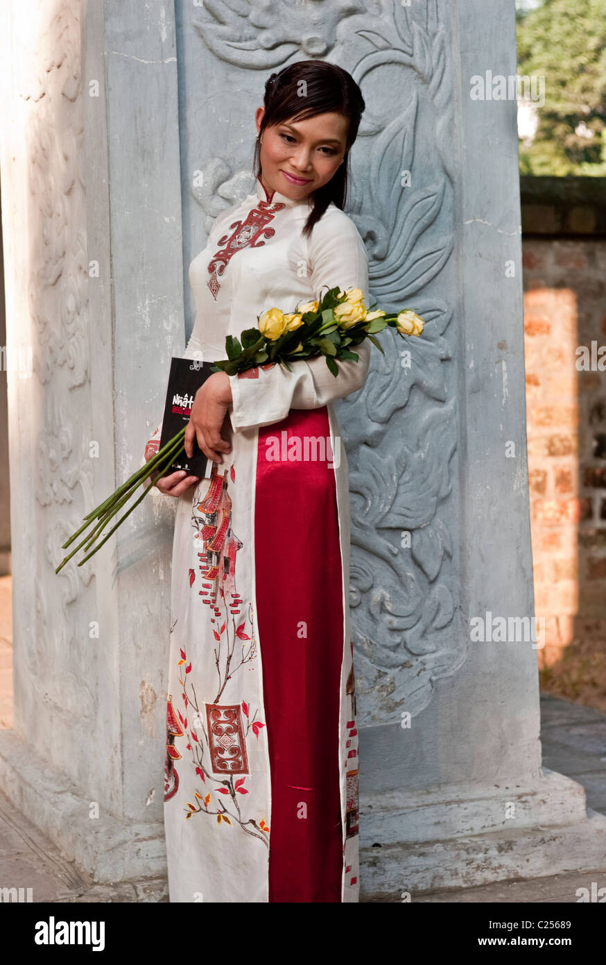 Young Vietnamese Lady in a Traditional gown , on Sunday. Hanoi, Vietnam ...
