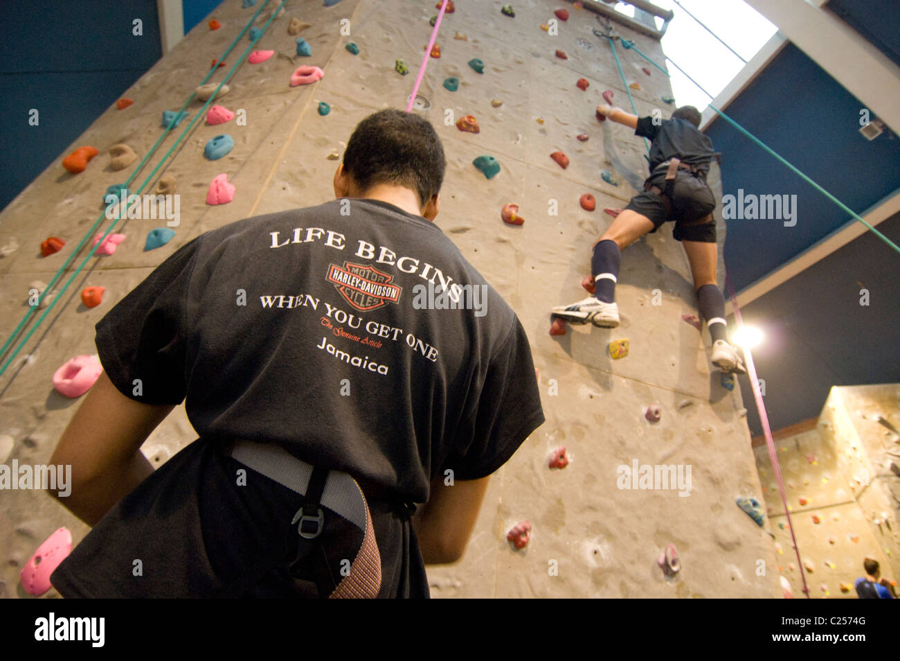 Boys using indoor climbing wall Stock Photo - Alamy