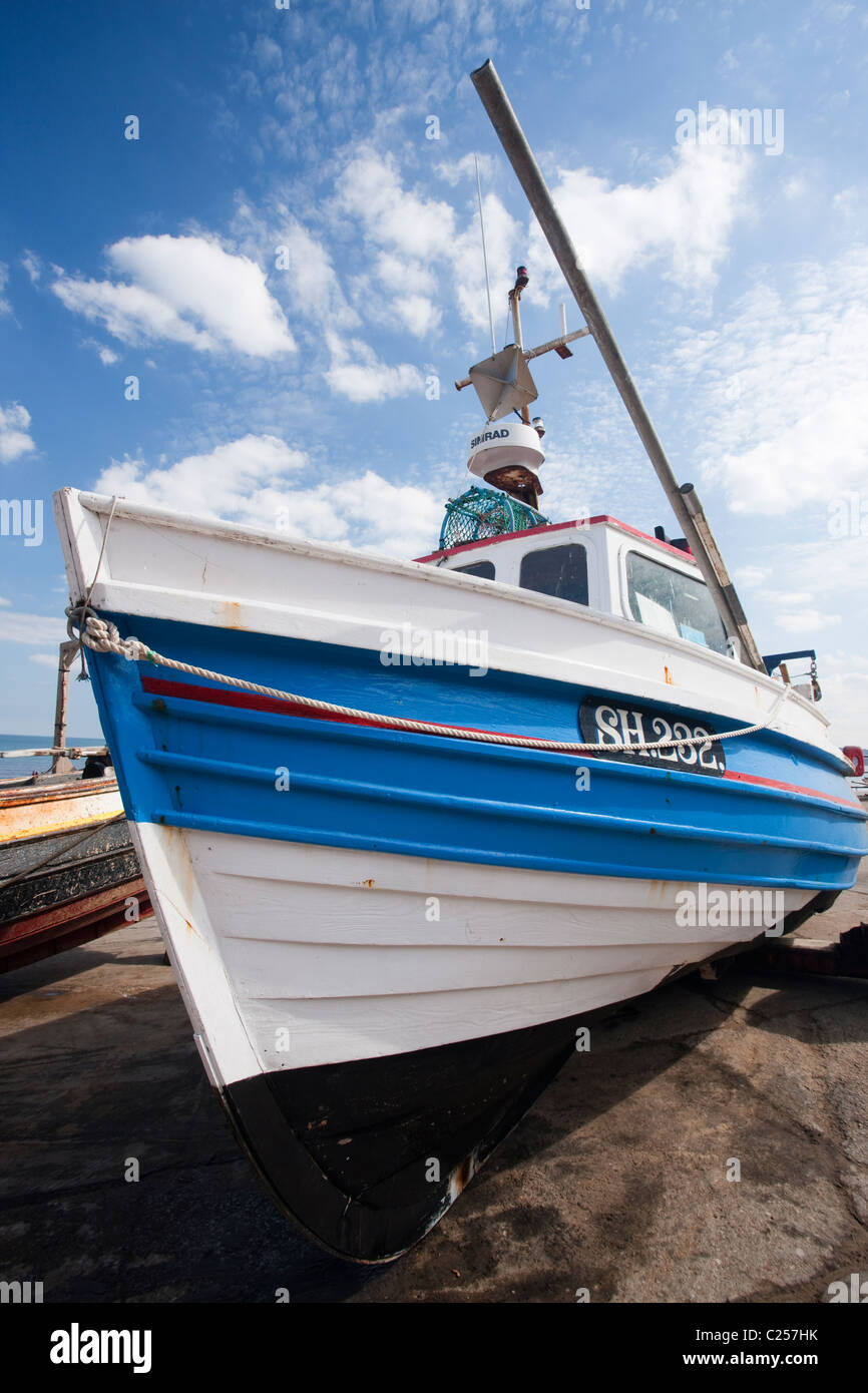 Fishing boats on the slipway to the beach at Filey, East Yorkshire ...