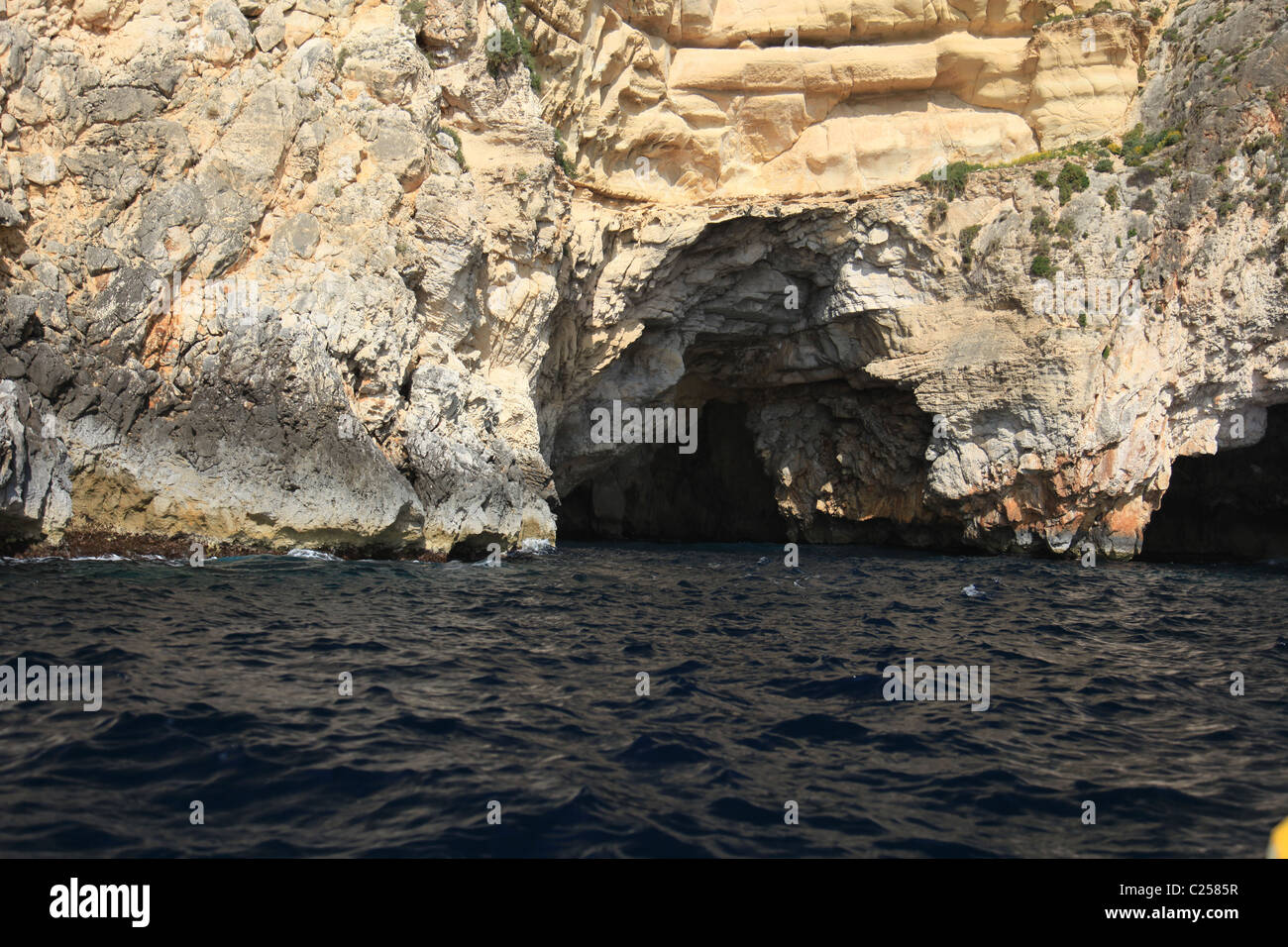 wave battered cliffs, dramatic rock formations, blue grotto area Stock ...