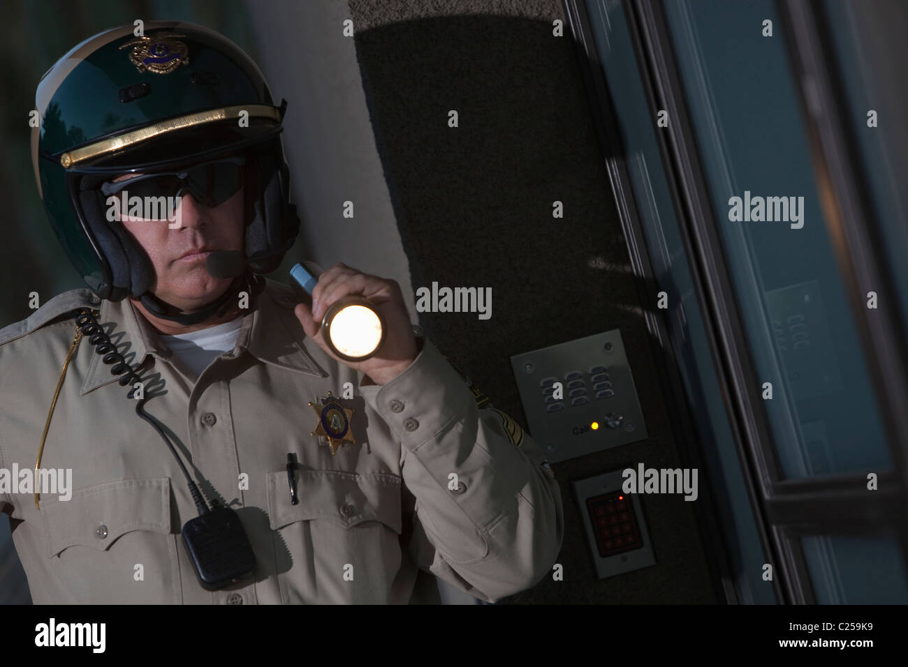 Nightwatch patrolman with flashlight Stock Photo - Alamy