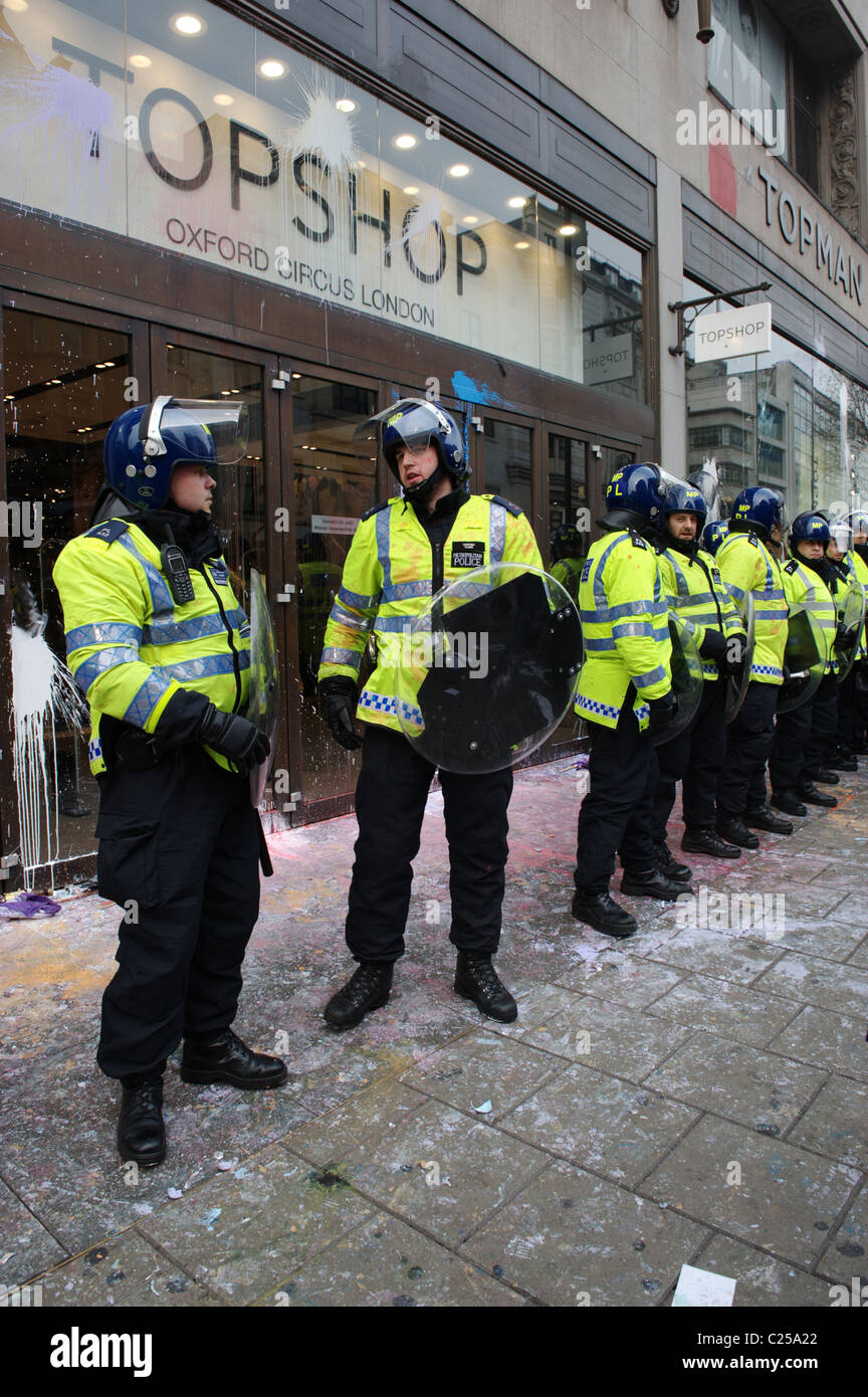 Police and protesters outside a painted bombed Top Shop Oxford Street ...
