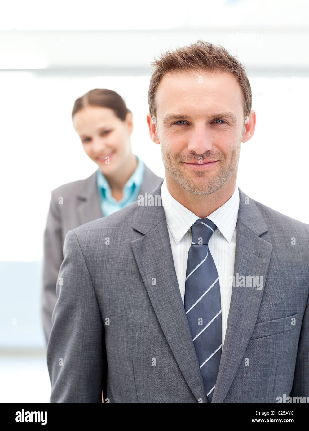 Two smiling business people posing in a row Stock Photo - Alamy Two smiling business people posing in a row Stock Photo - Alamy