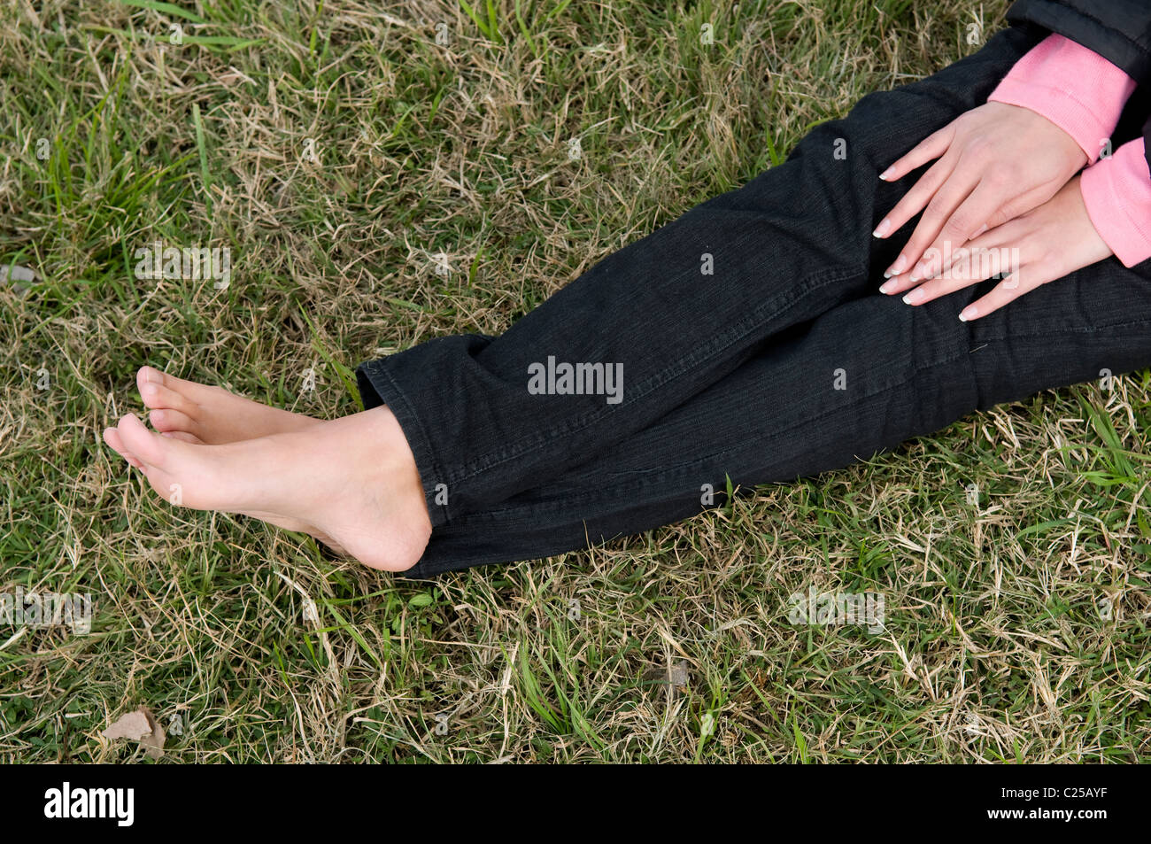 Close up of female university student legs lying on campus Stock Photo ...