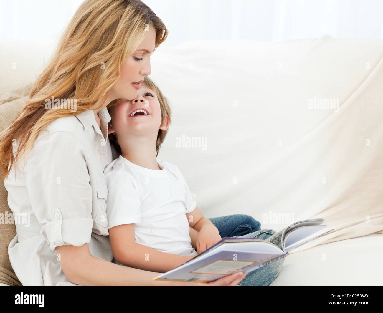 Mother reading with her son Stock Photo - Alamy
