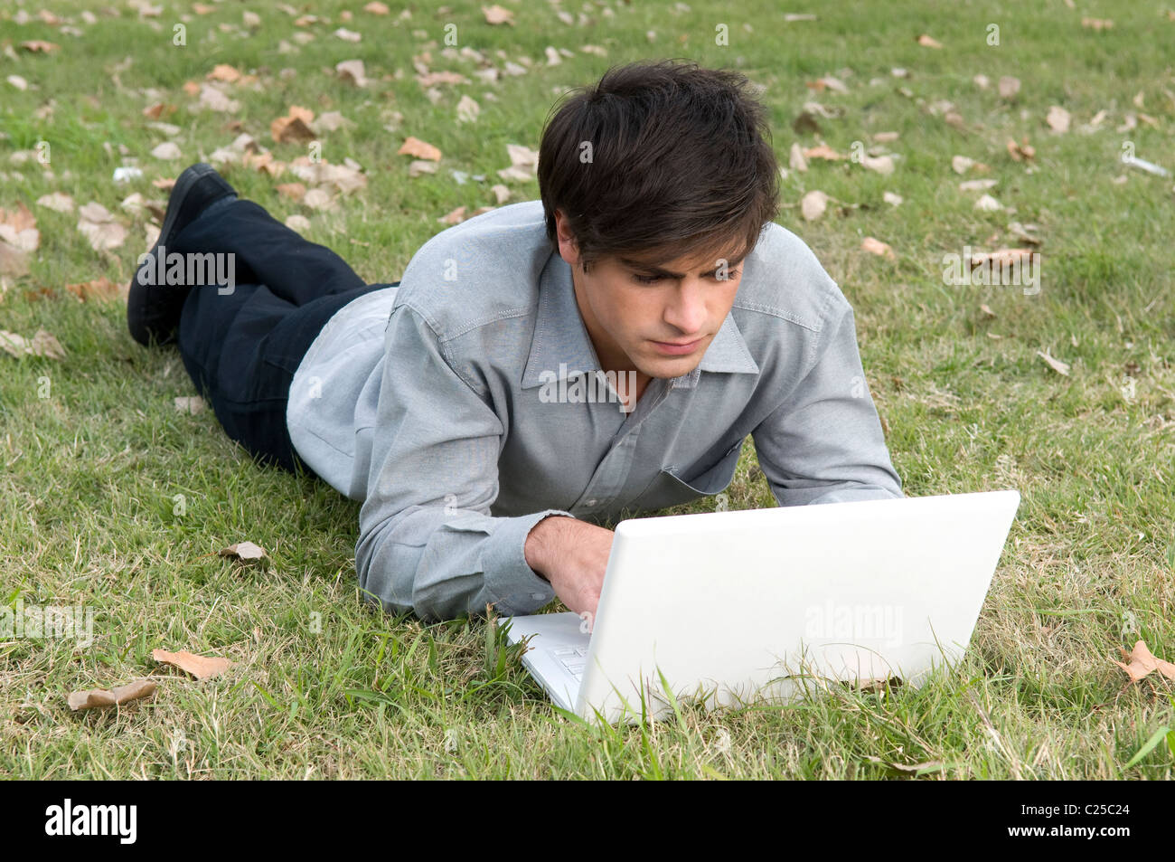 man, lay, laying, down, on, a, the, field, campus, field, outdoors ...