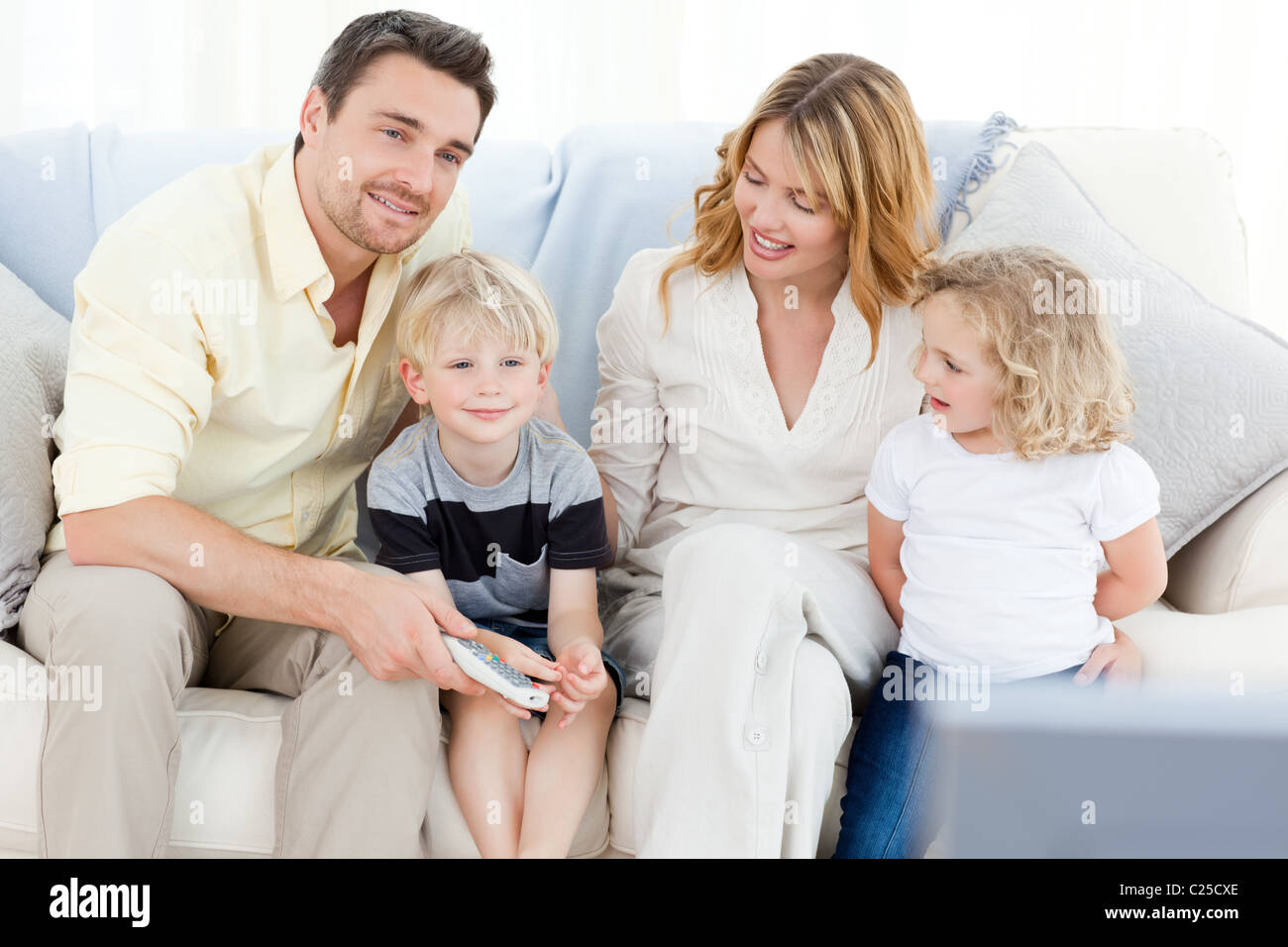 Woman watching child with dad hi-res stock photography and images - Alamy
