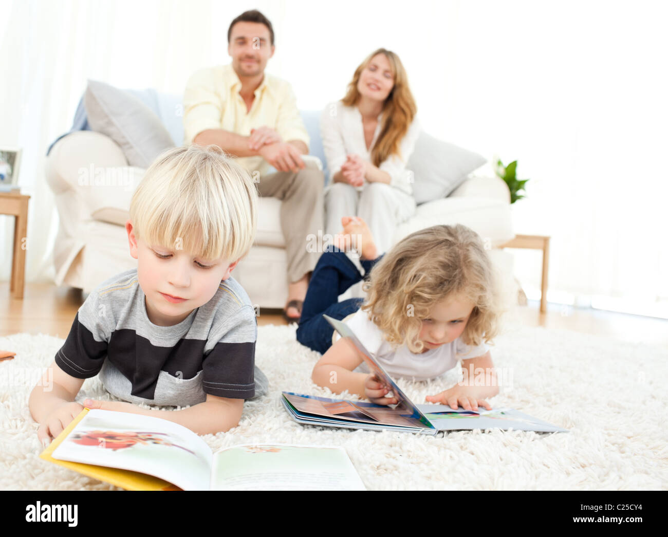 Children reading books Stock Photo - Alamy