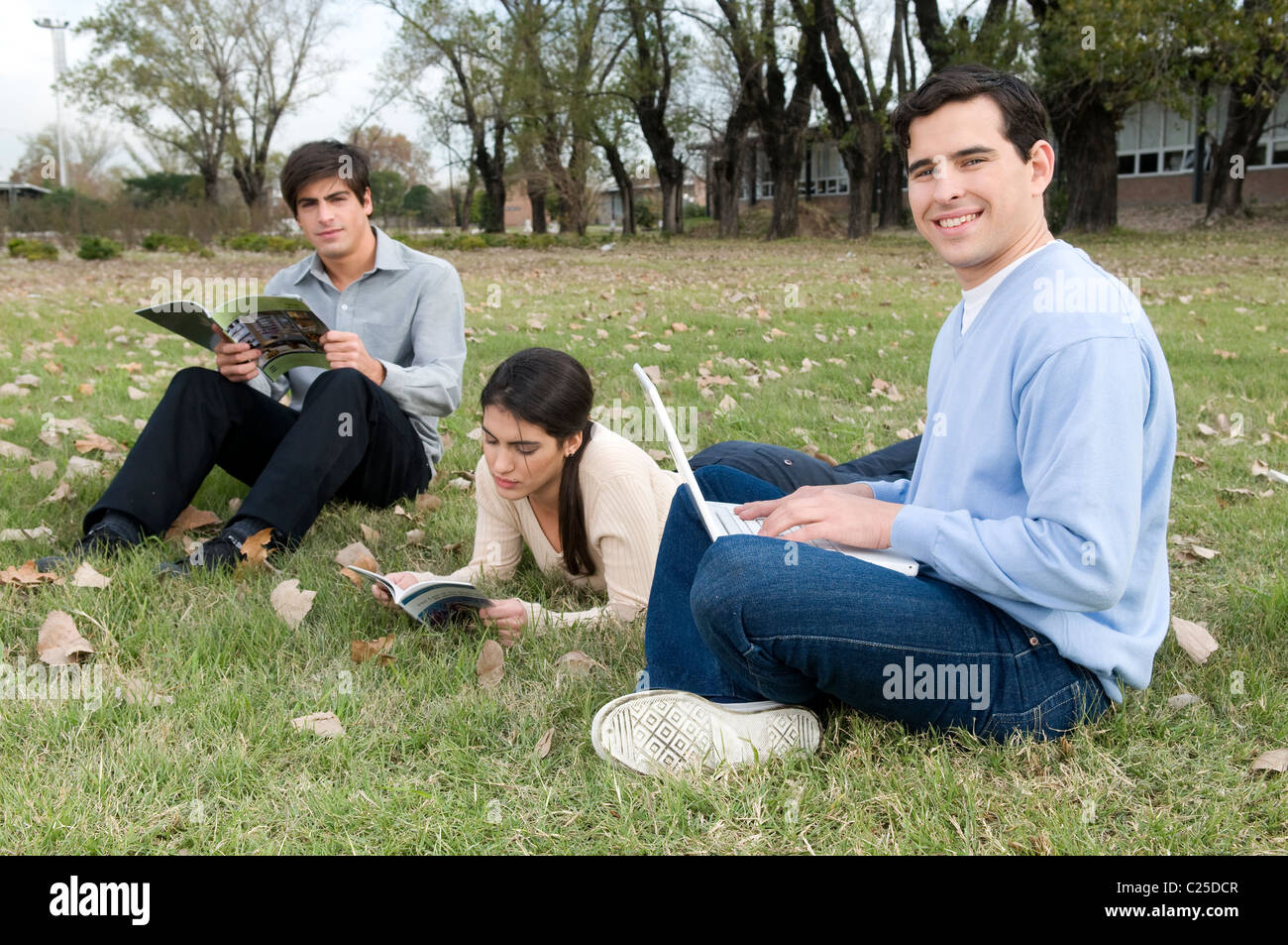 students, at, campus, park, lying, sitted, down, reading, using ...