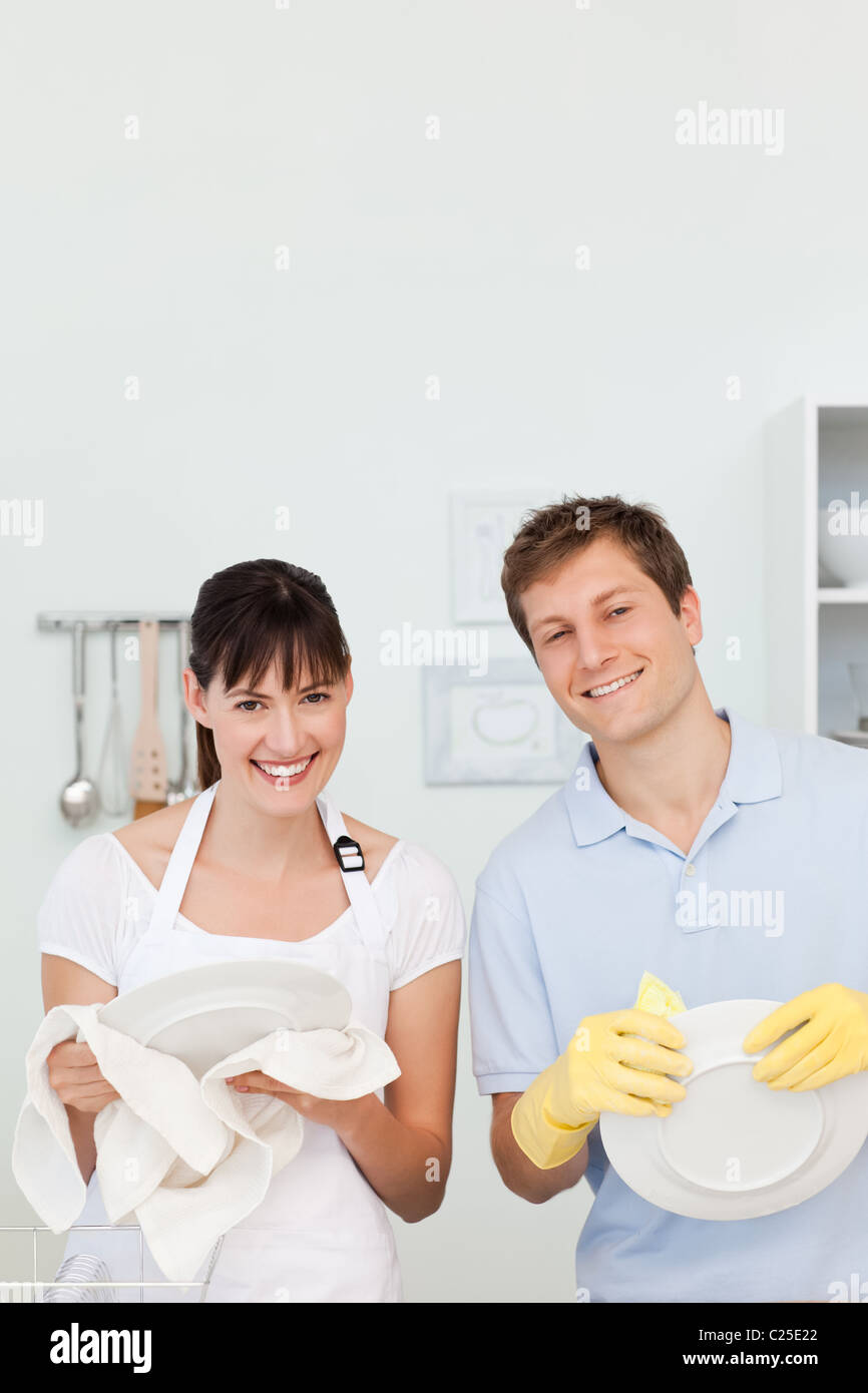 Lovers washing dishes together Stock Photo - Alamy