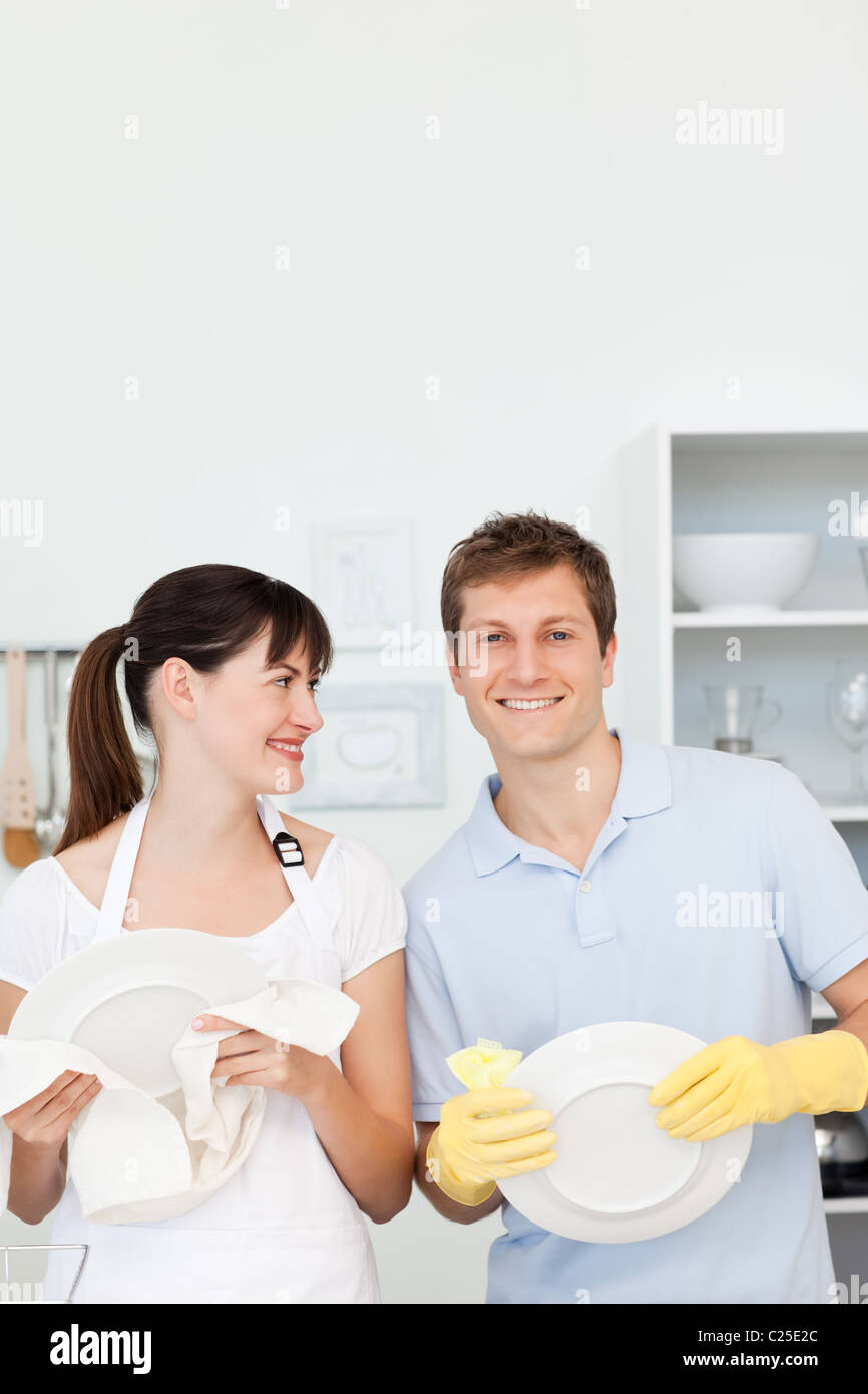 Lovers washing dishes together Stock Photo - Alamy