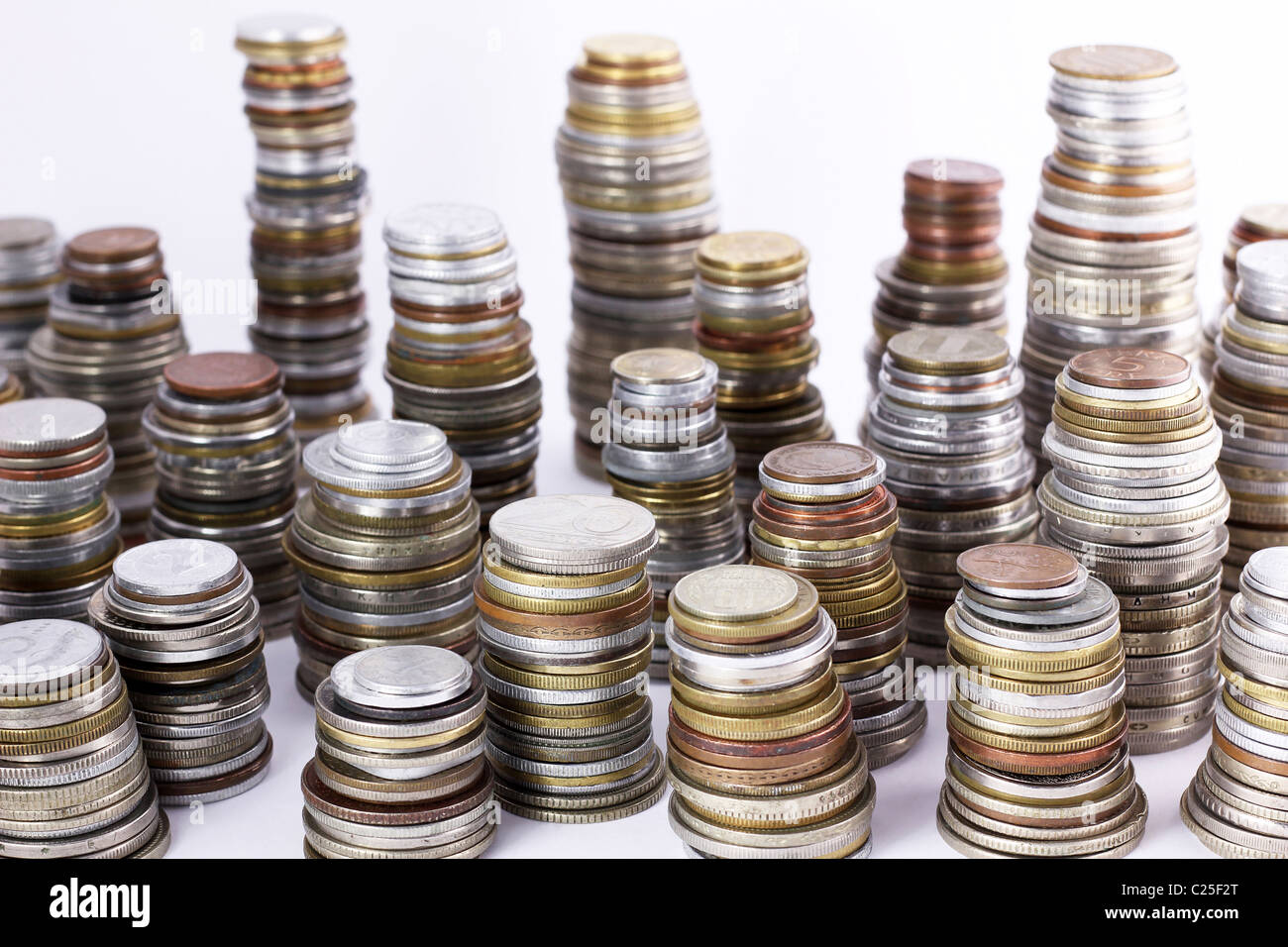 Stacks of world coins Stock Photo - Alamy