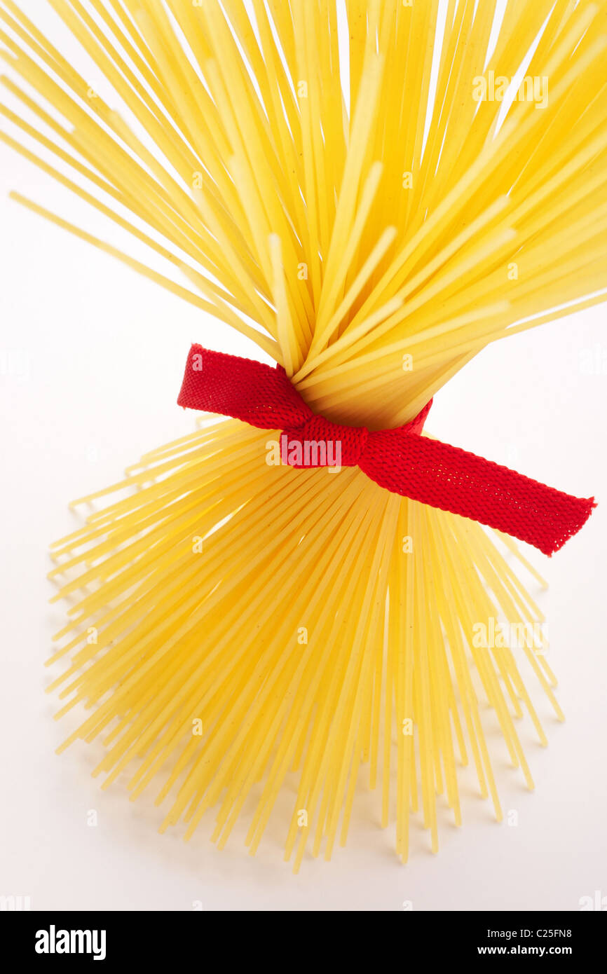 Bunch of spaghetti tied up with red ribbon isolated on white Stock ...