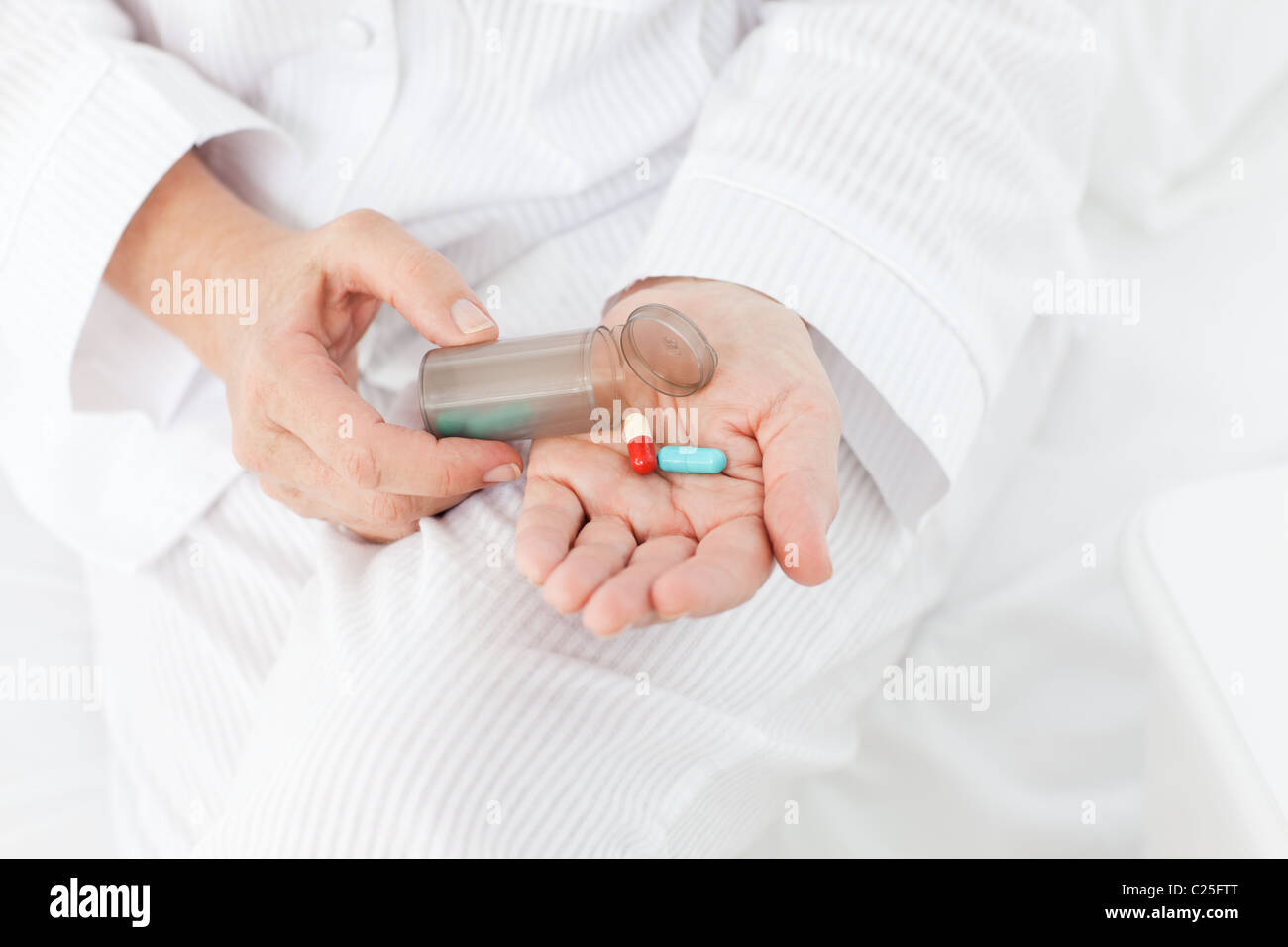 Sick woman taking her pills at home Stock Photo - Alamy