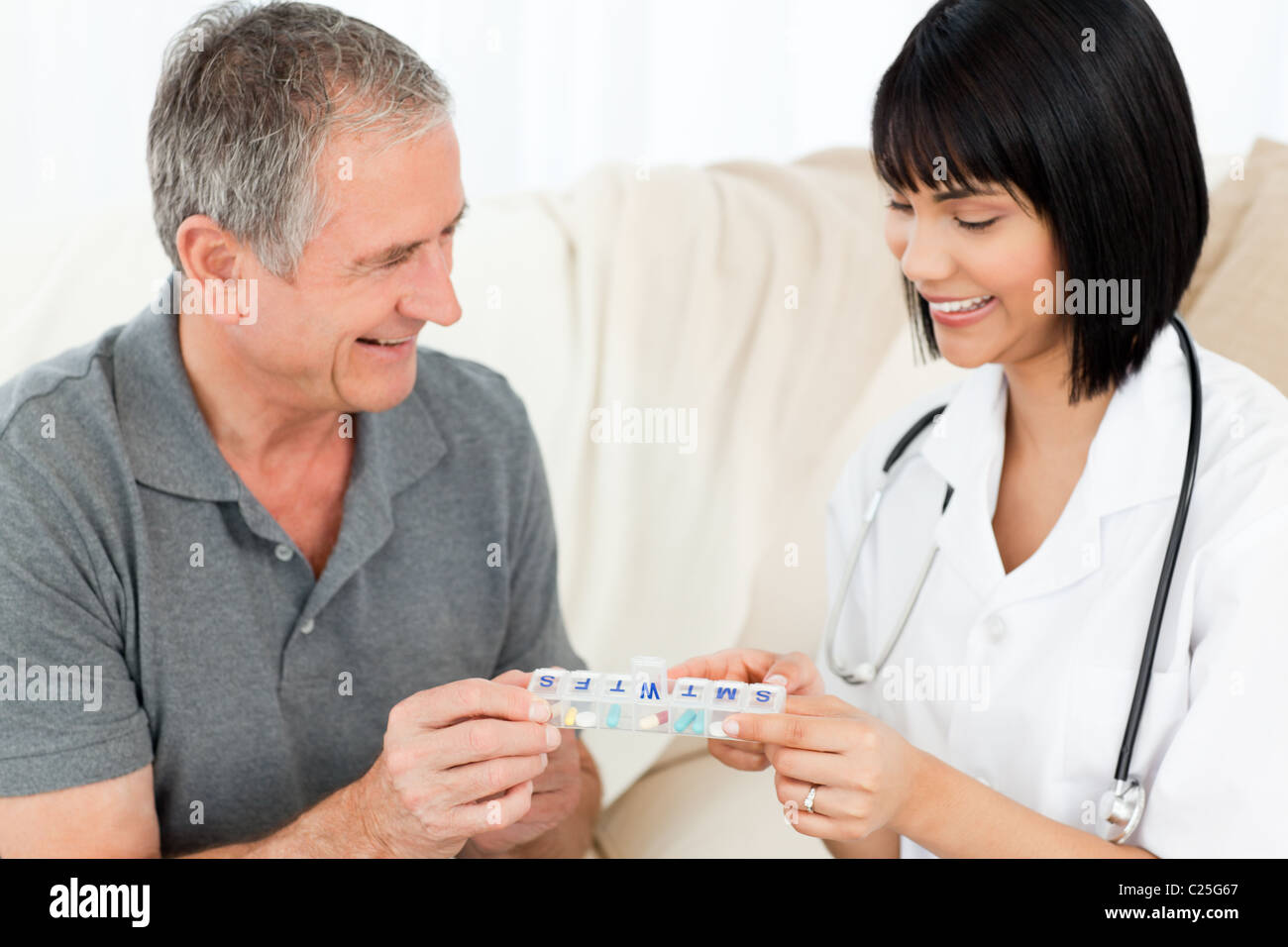 Nurse showing pills patient hi-res stock photography and images - Alamy