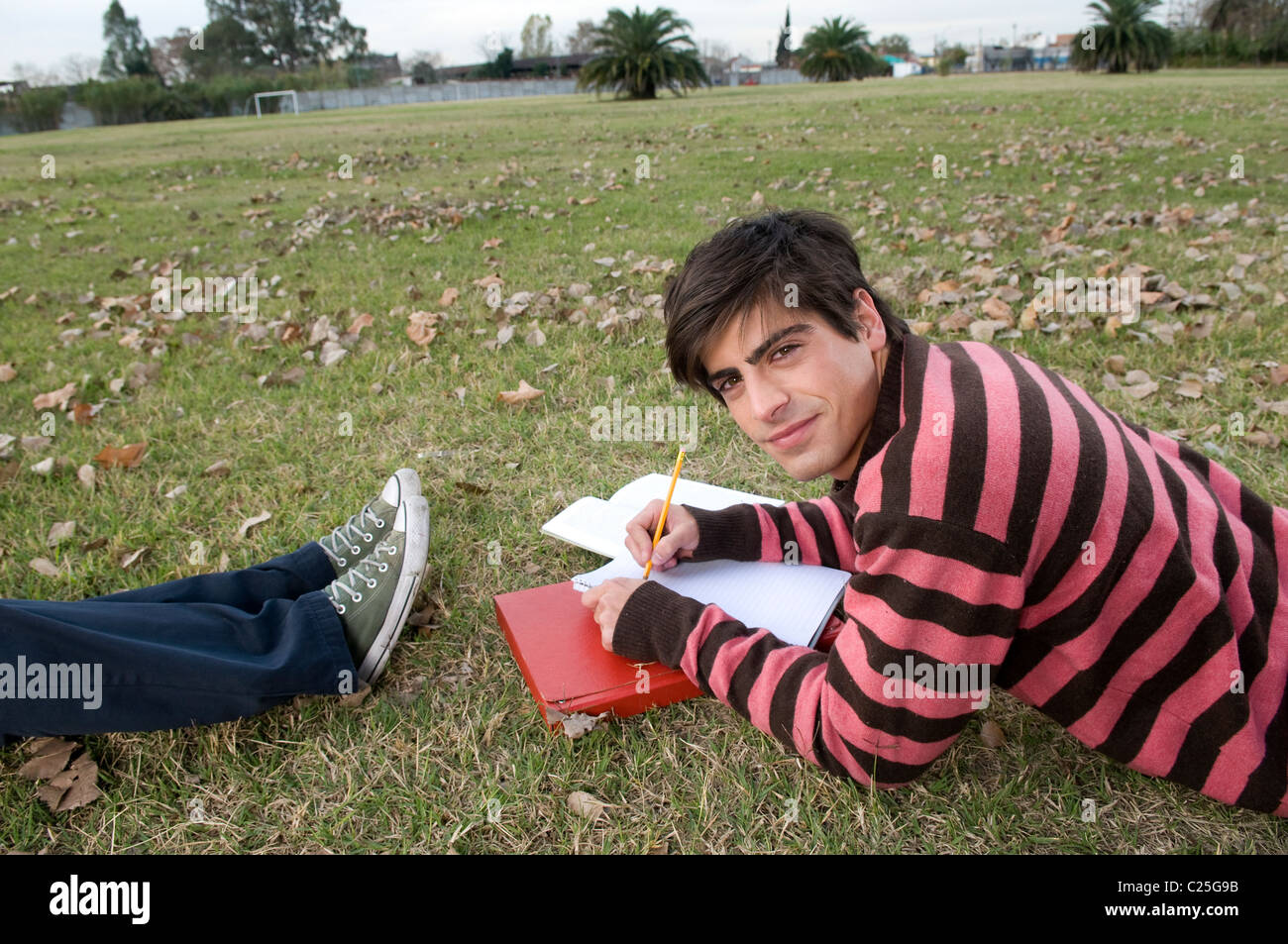 man, looking, at, the, camera, lay, laying, write, writing, notes ...