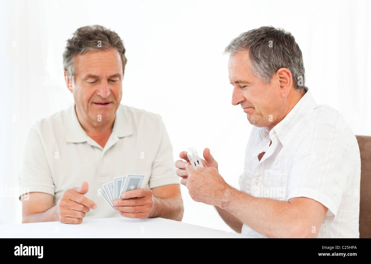 Men playing cards Stock Photo - Alamy