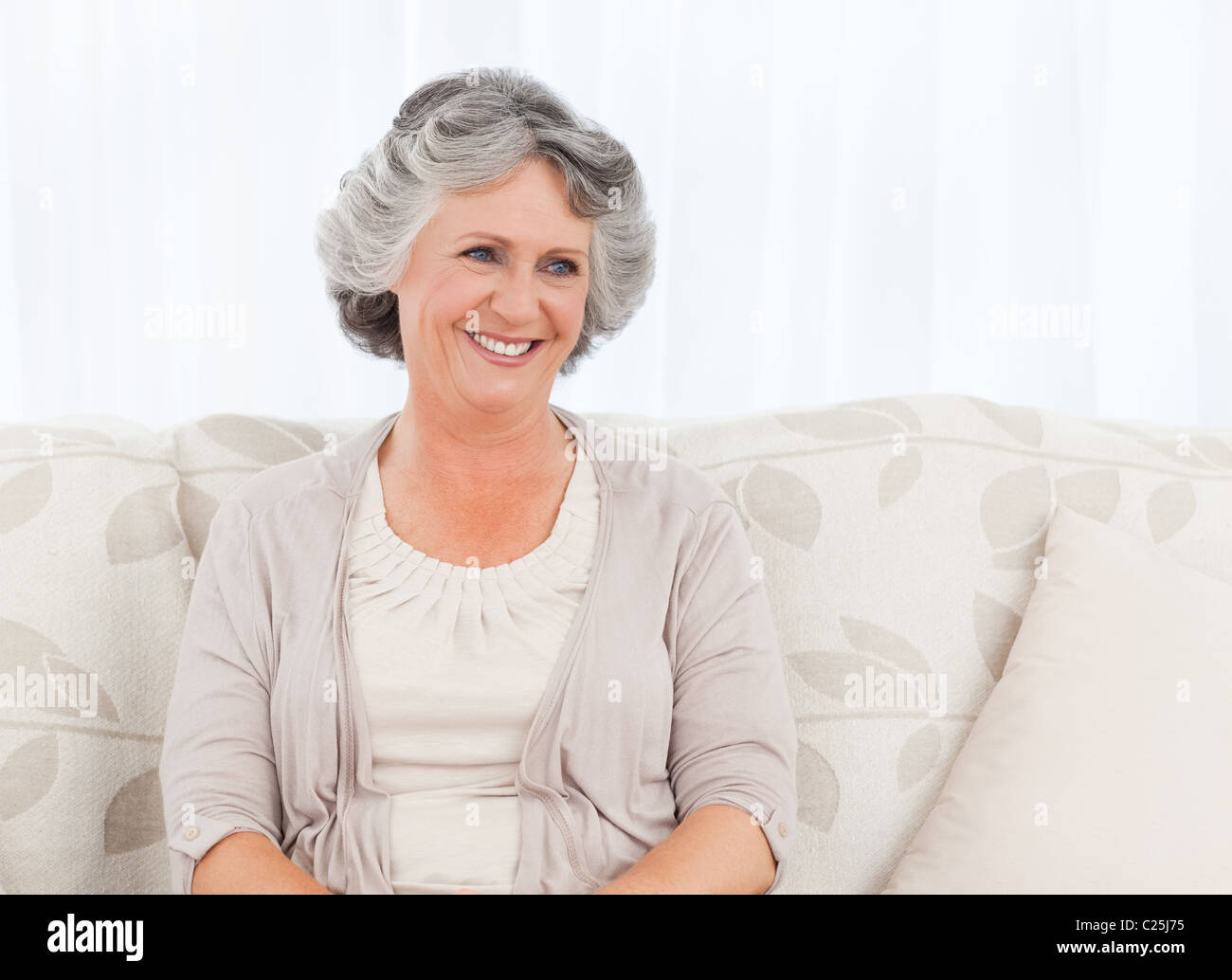 Smiling retired woman Stock Photo - Alamy