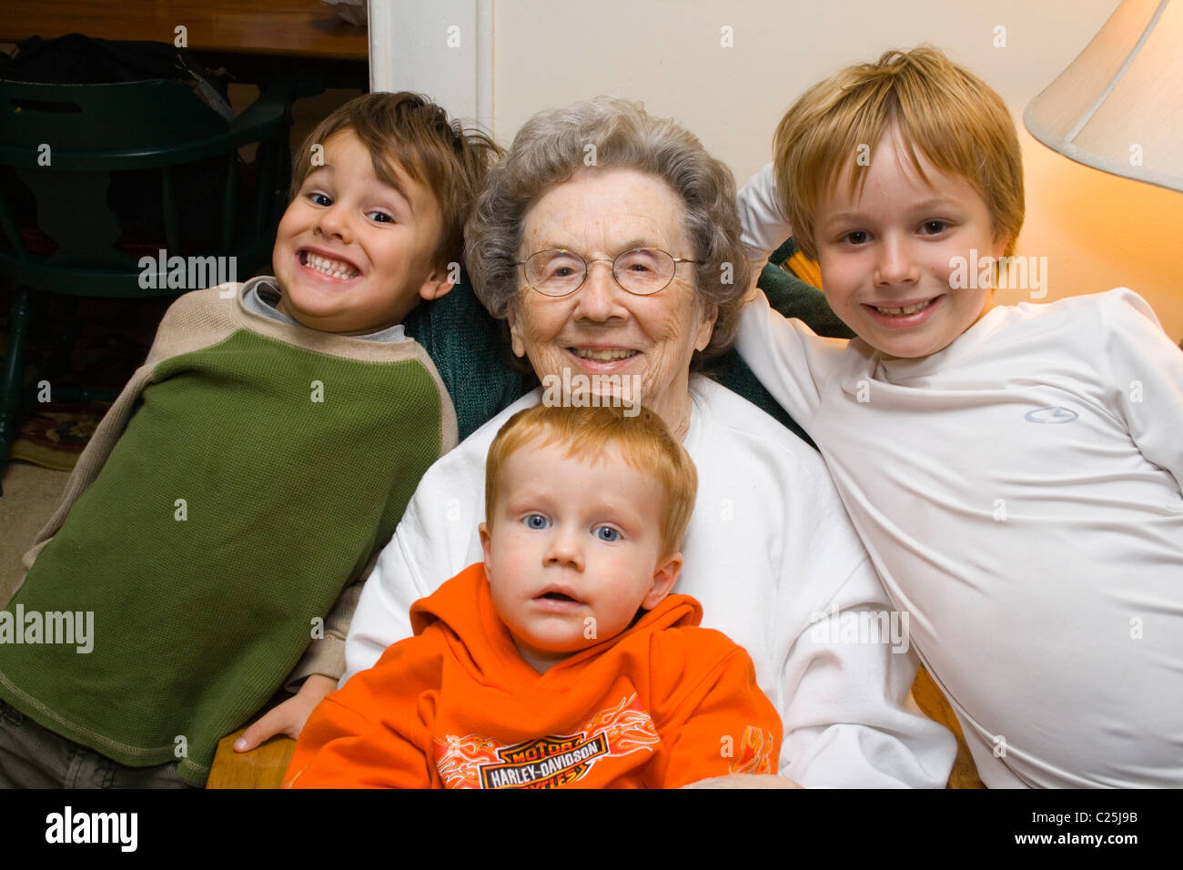 Portrait great grandmother age 93 with 3 of her great grandchildren age ...