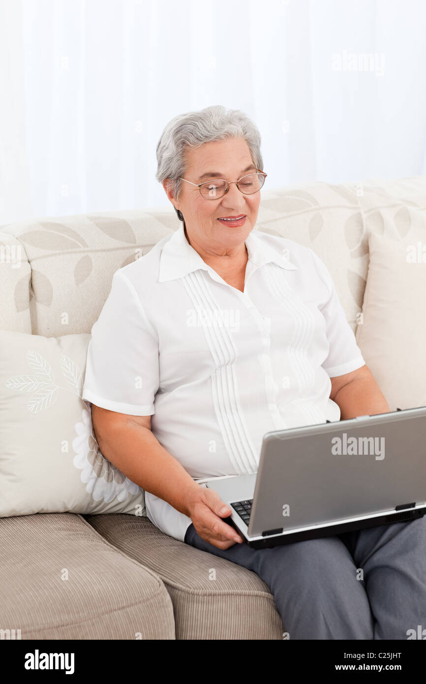 Elderly woman looking at a laptop Stock Photo - Alamy