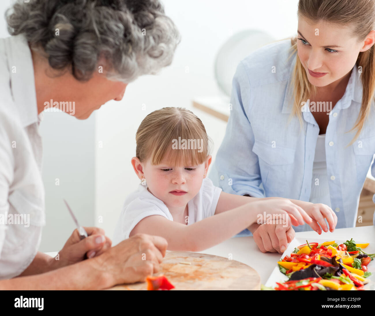 Family cooking together in the kitchen at home Stock Photo - Alamy