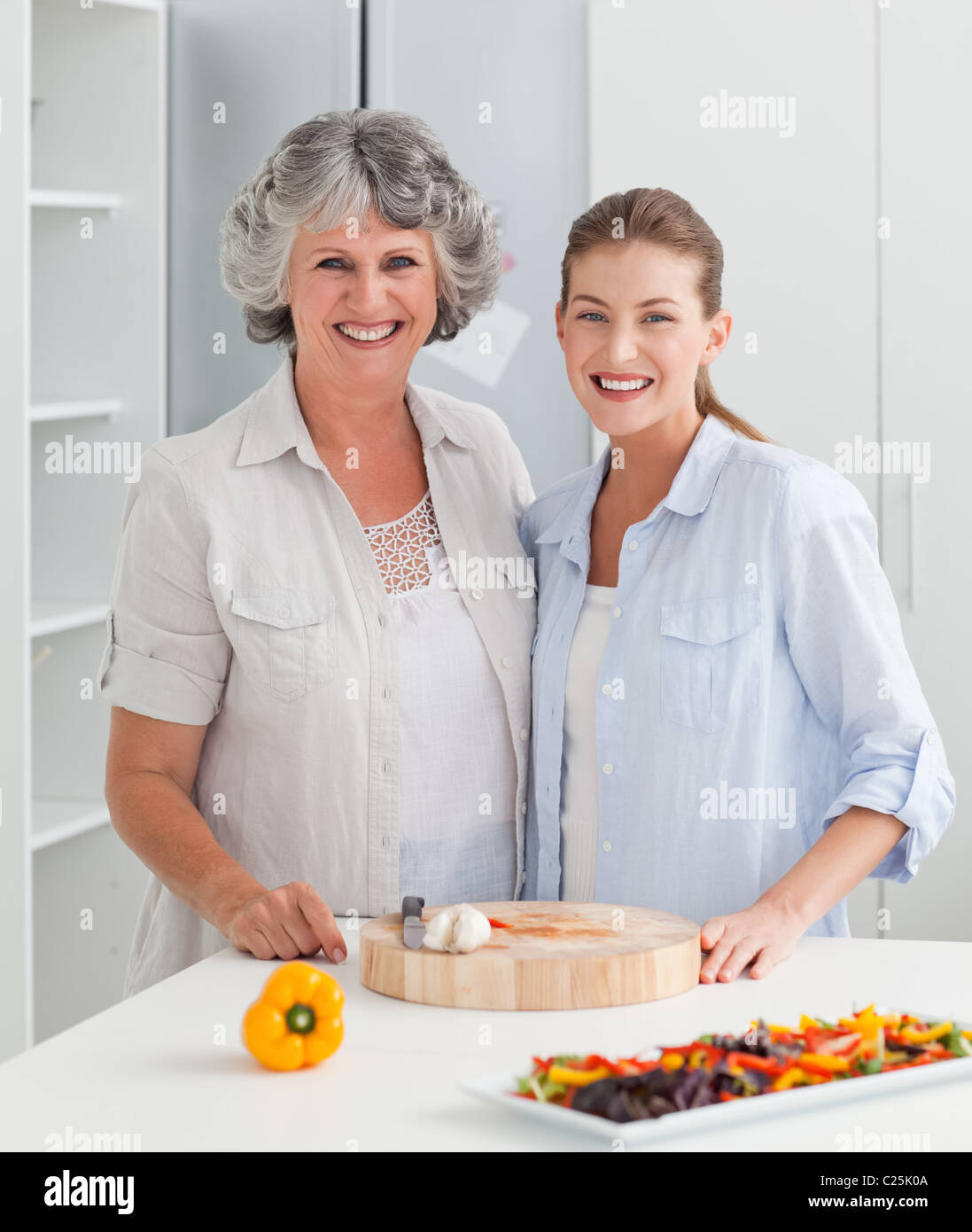 Woman cooking with her mother at home Stock Photo - Alamy