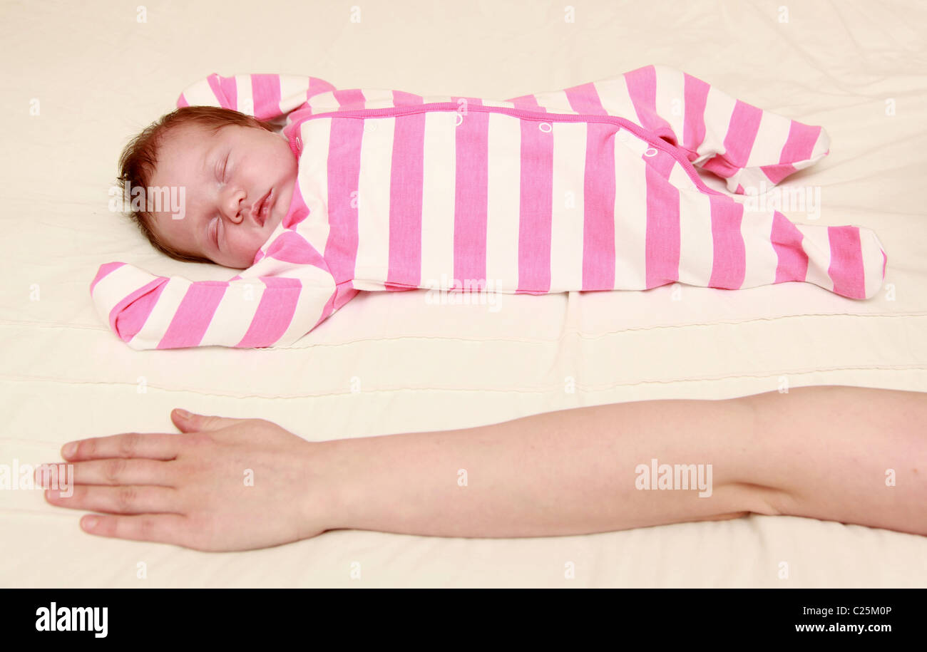 Newborn baby girl and mother's arm Stock Photo - Alamy