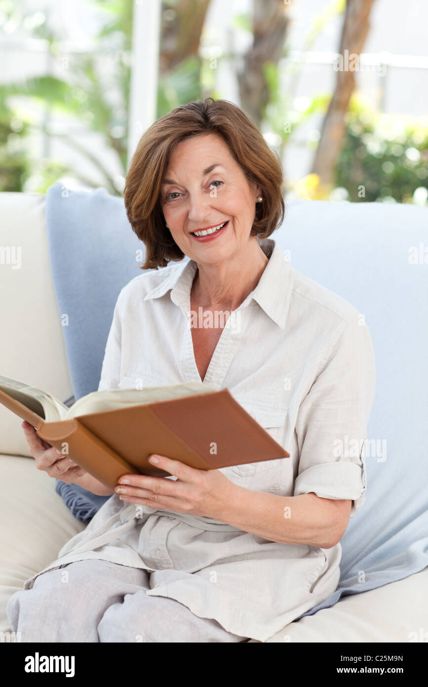 Old woman reading her book Stock Photo - Alamy