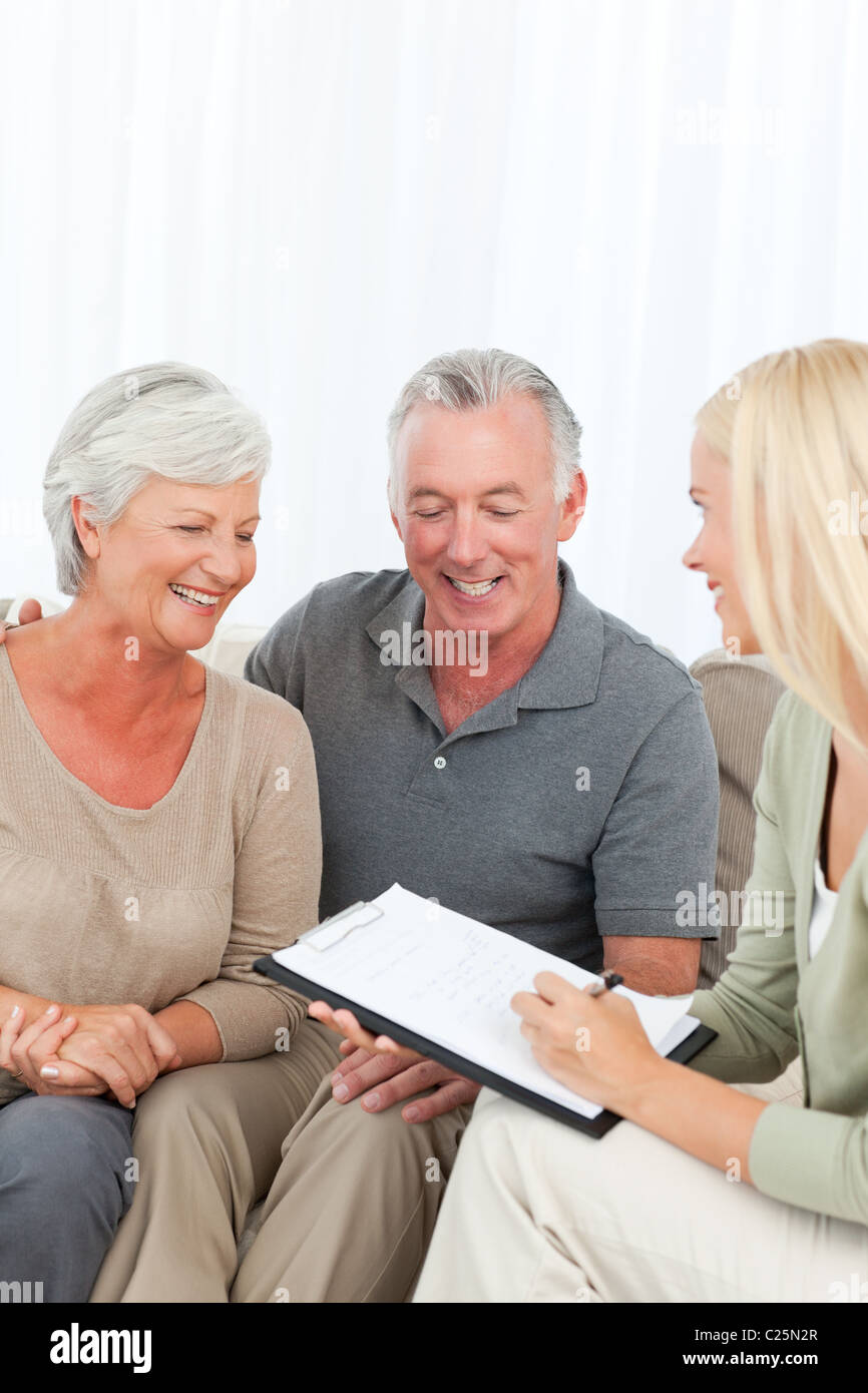 Seniors with doctor at home Stock Photo - Alamy