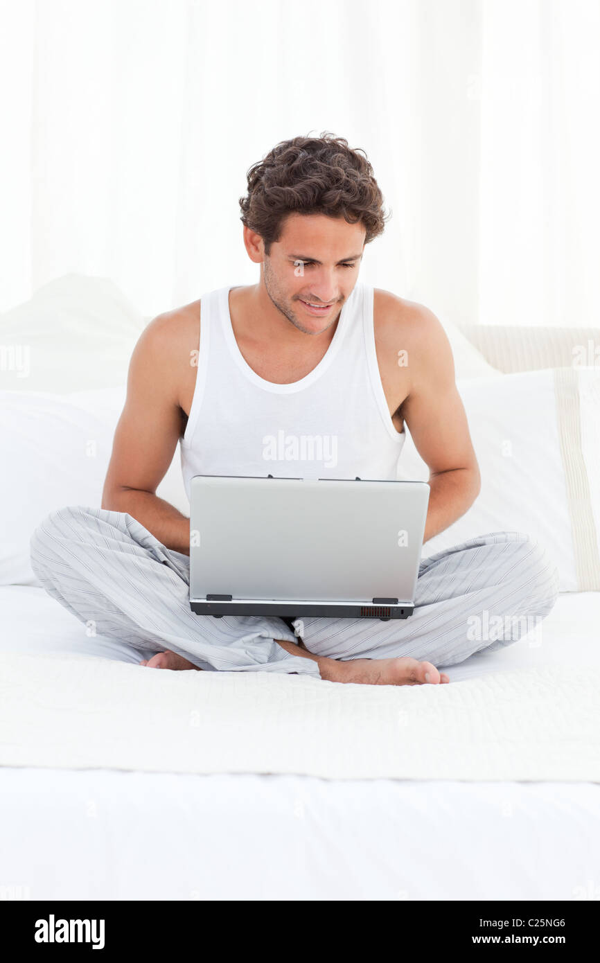 Man working on his laptop at home Stock Photo - Alamy