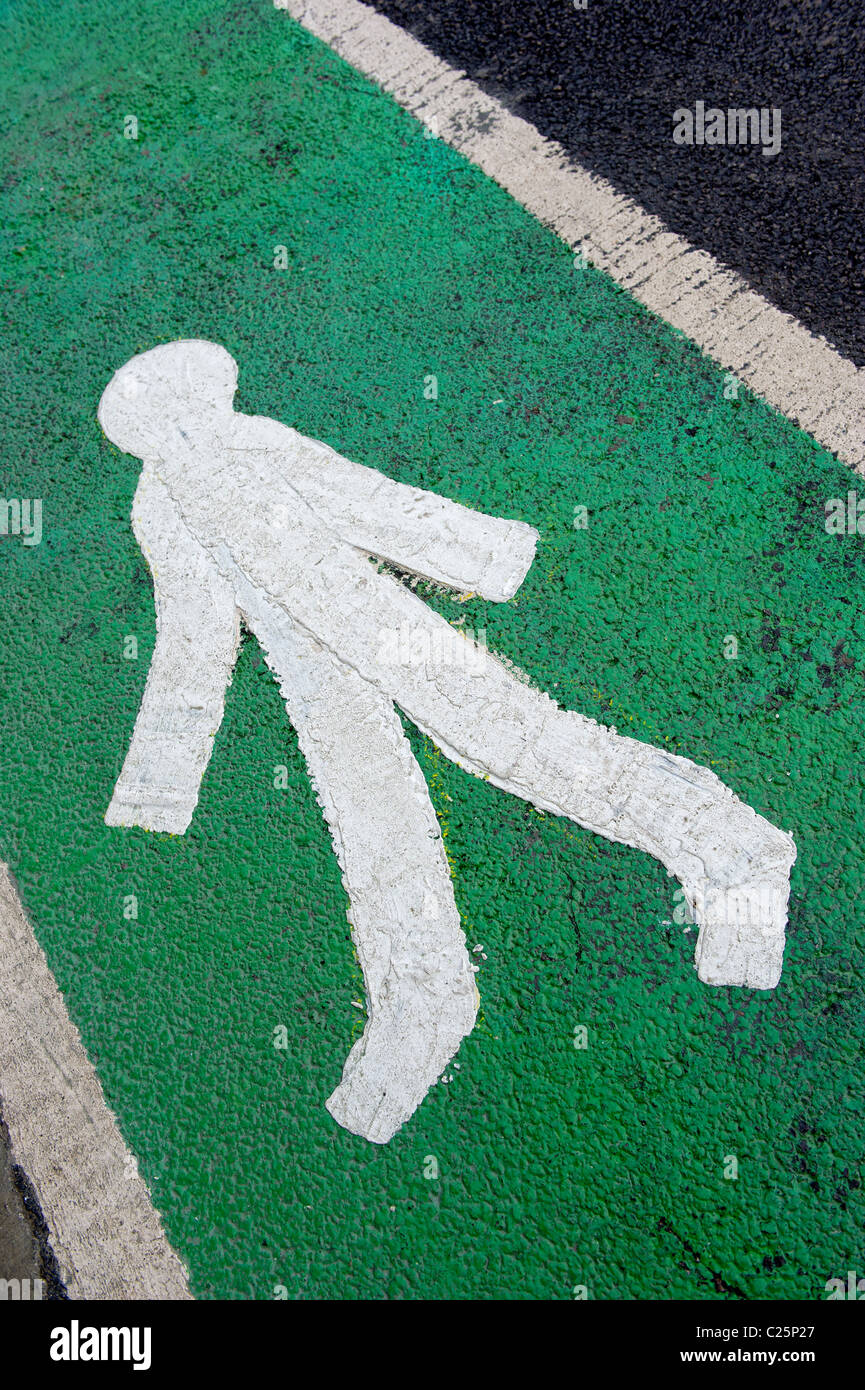 Painted sign indicating pedestrian walkway Stock Photo - Alamy