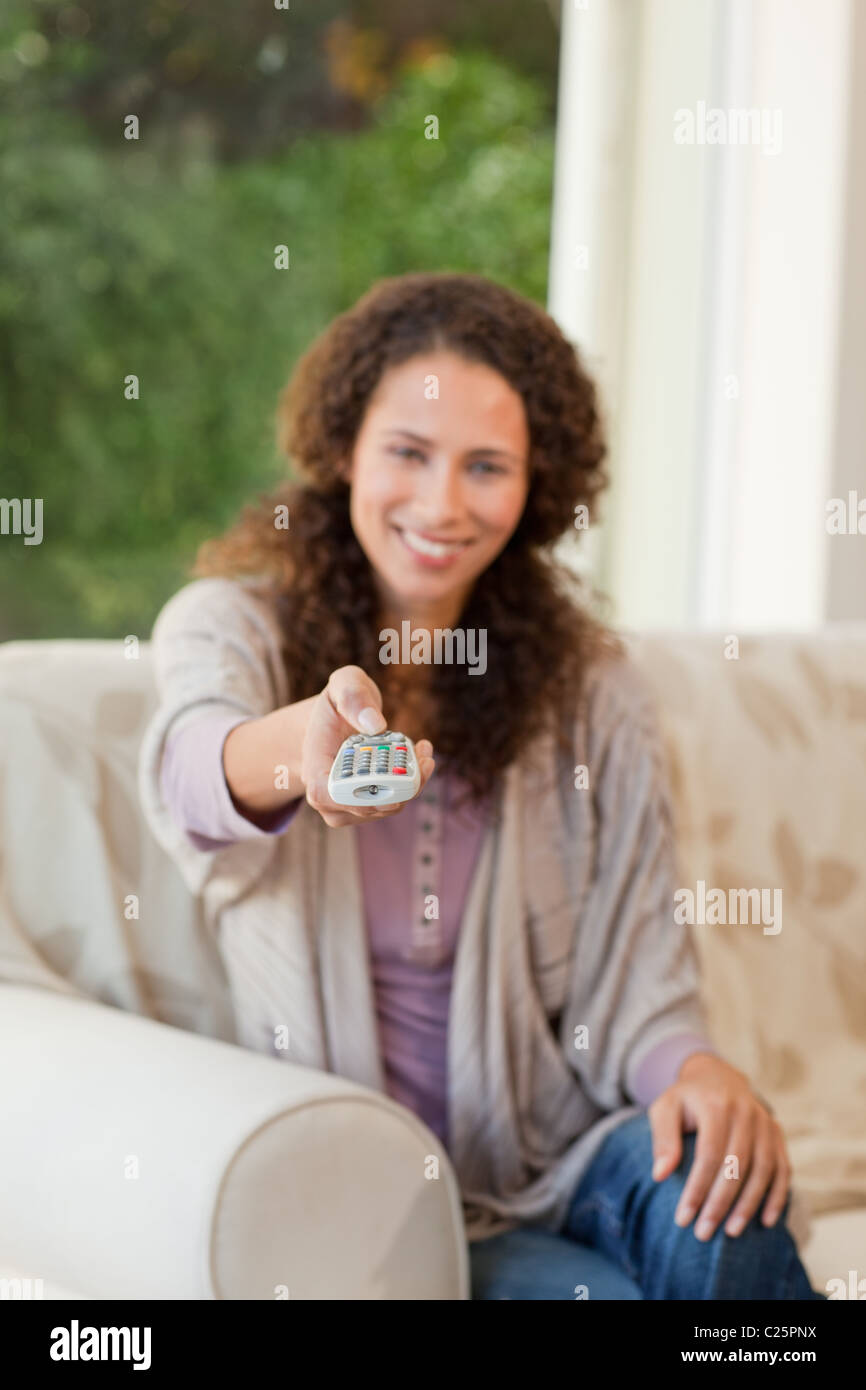 Woman with her remote Stock Photo - Alamy