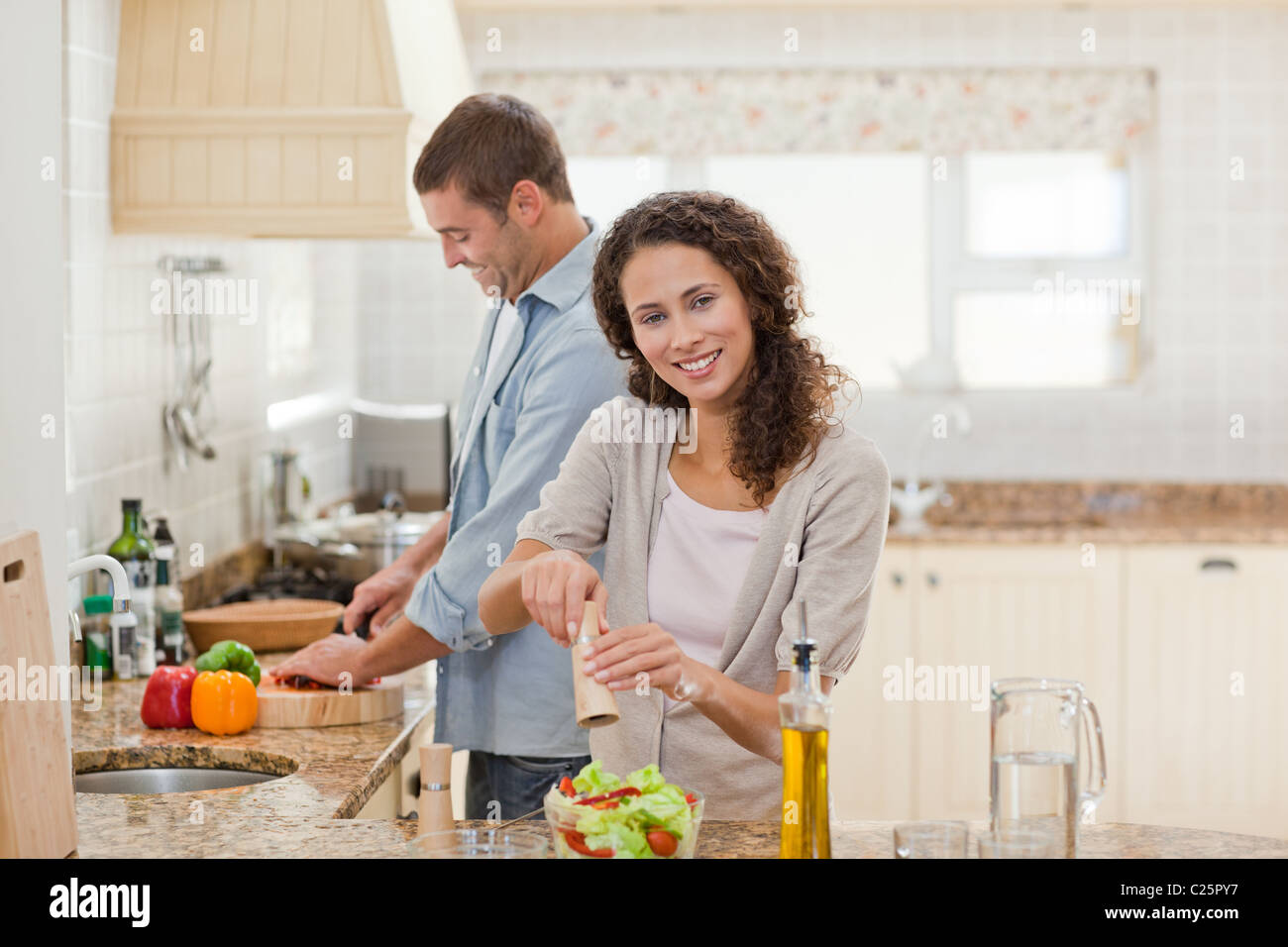 Handsome man cooking with his girlfriend Stock Photo - Alamy