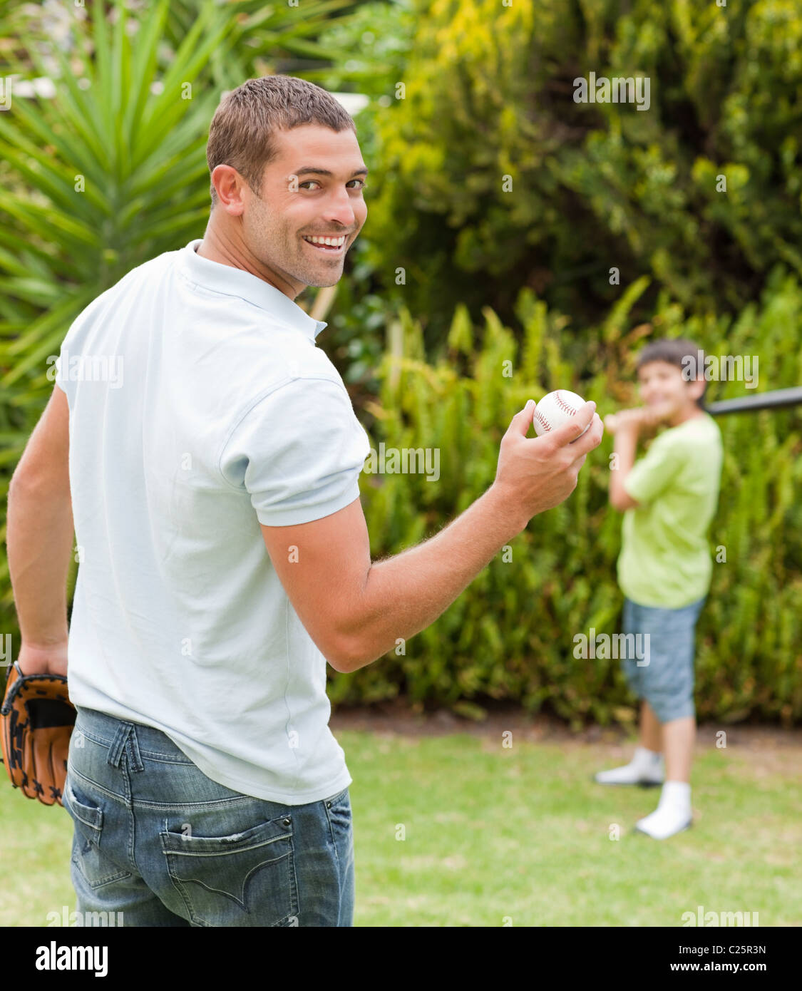 Happy father and his son playing baseball Stock Photo - Alamy
