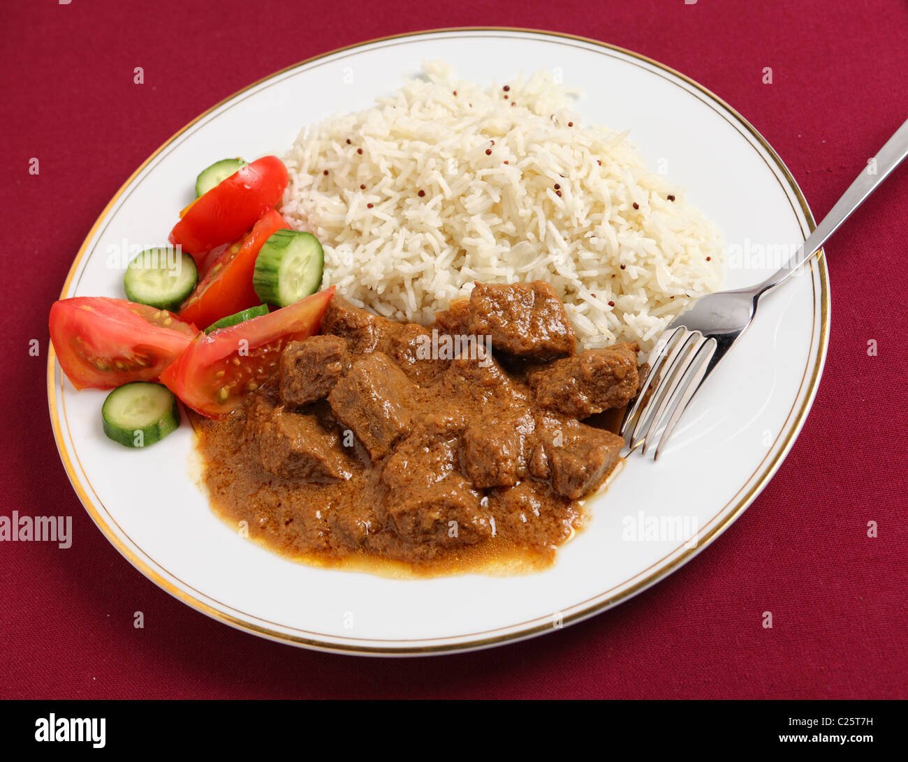 A meal of north Indian or Pakistani-style beef korma curry with basmati ...