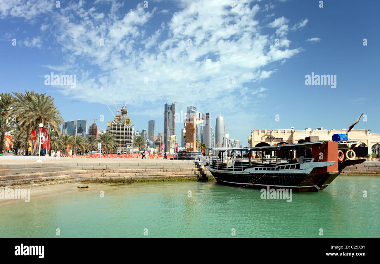 A view of the Corniche in the heart of Doha, Qatar, with a dhow used ...