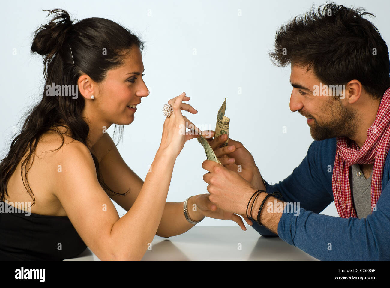 Couple agreeing on sharing money, financial concept Stock Photo - Alamy