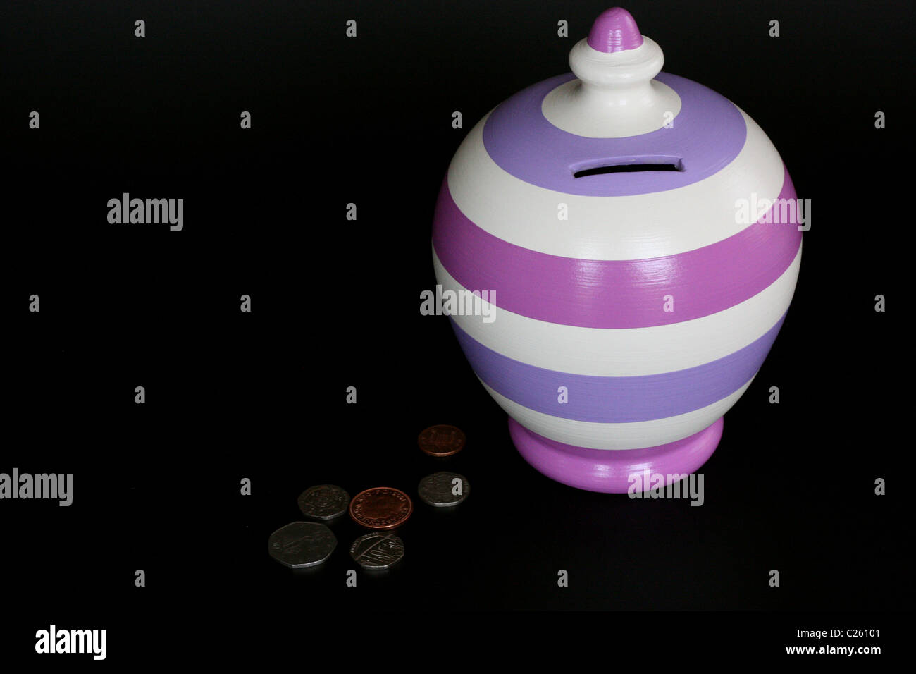 money box with coins Stock Photo - Alamy