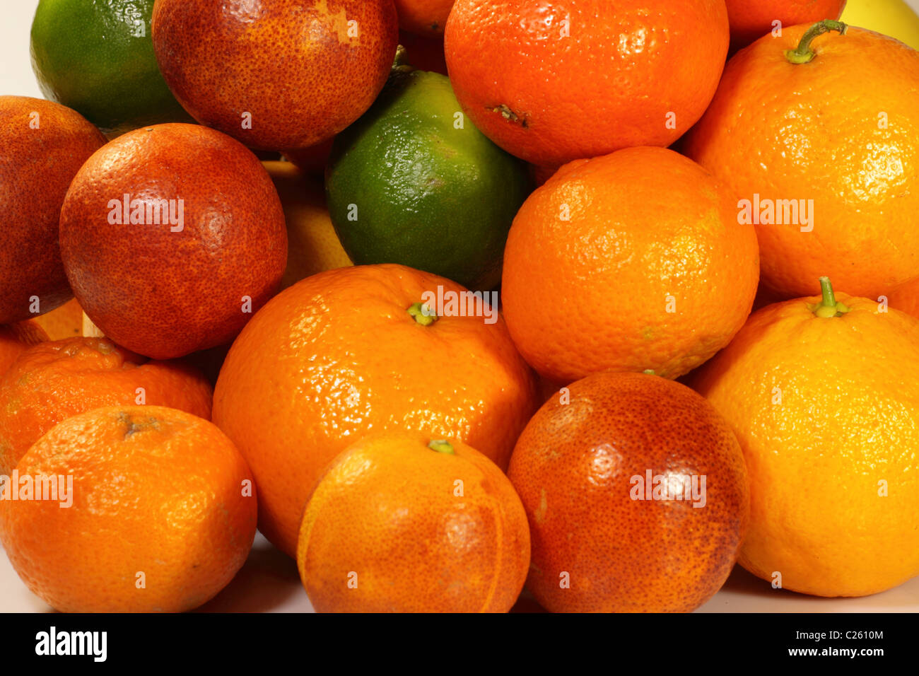 assortment of different colored fruits to eat and decorate Stock Photo ...