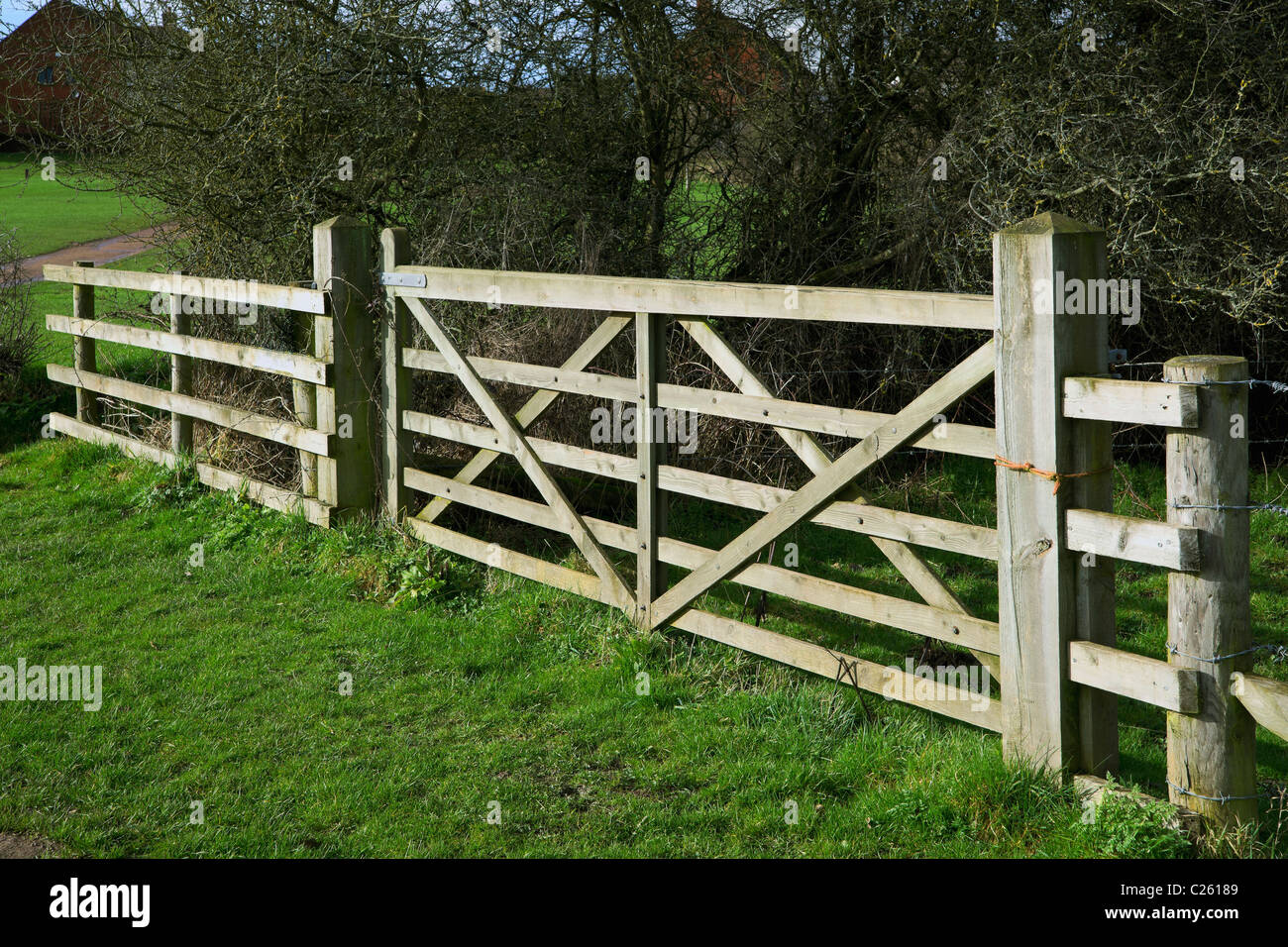 a sunlit gate - the entrance to a house Stock Photo - Alamy