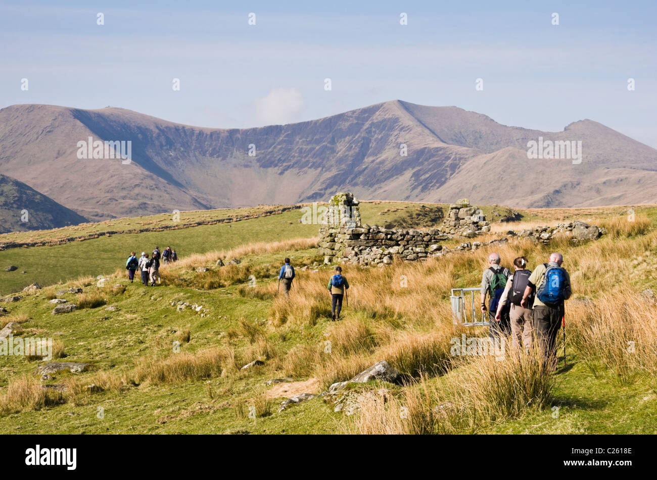 Group of Ramblers walking on path following a disused railway line in ...